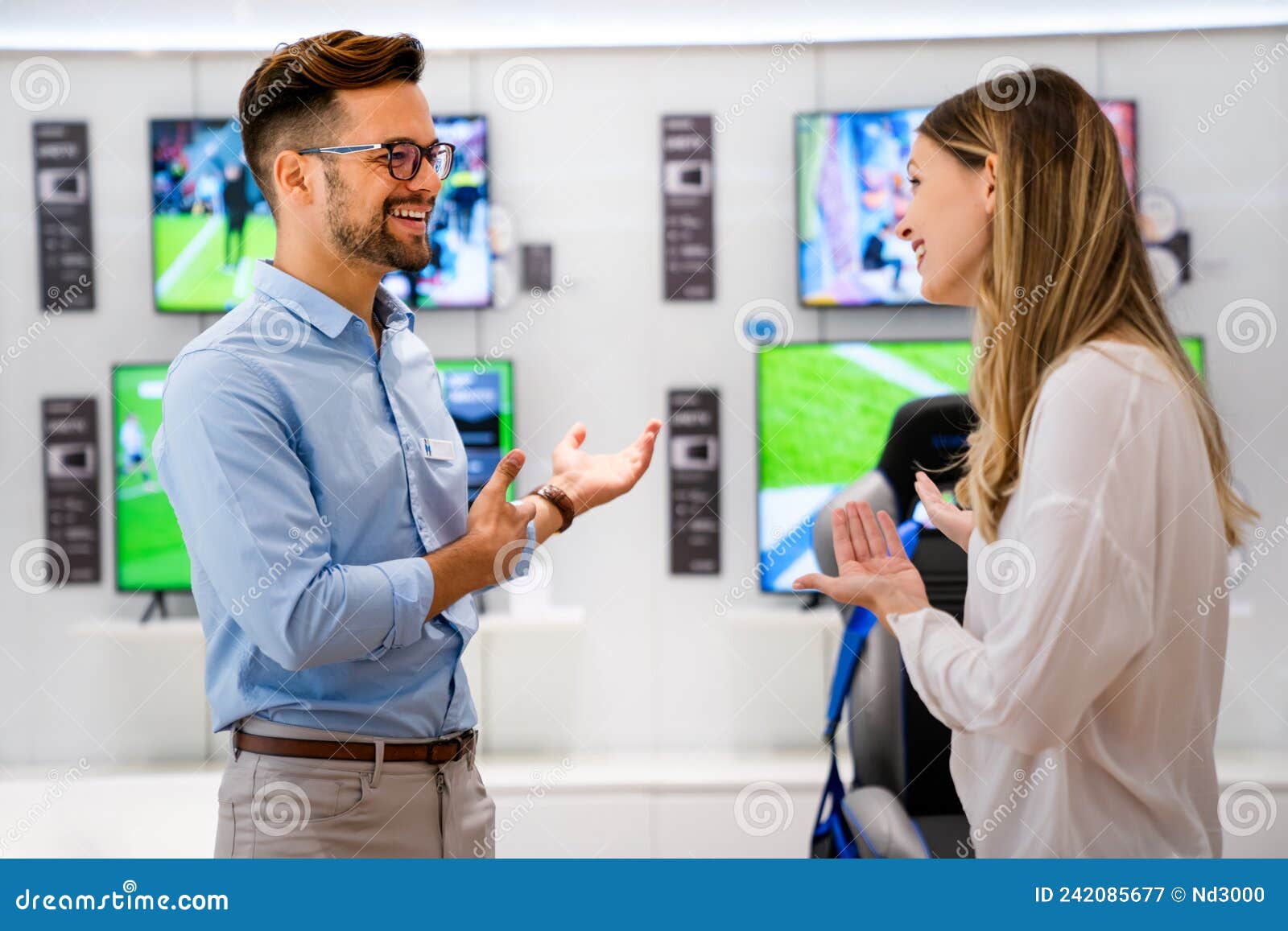 Happy People in Consumer Electronics Retail Store Looking at New ...