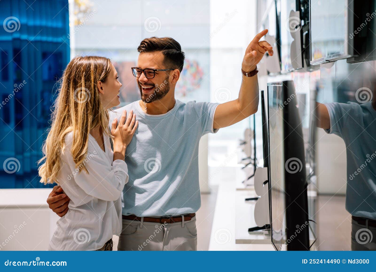 Happy People in Consumer Electronics Retail Store Looking at New ...