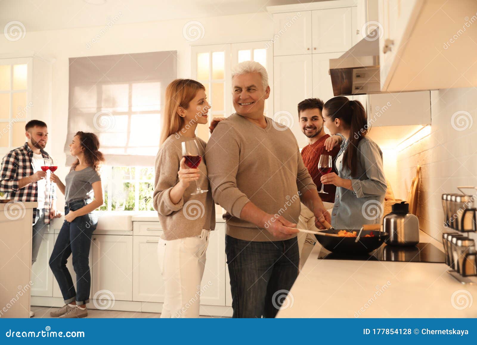 Happy People Cooking Food in Kitchen Stock Photo - Image of alcohol ...