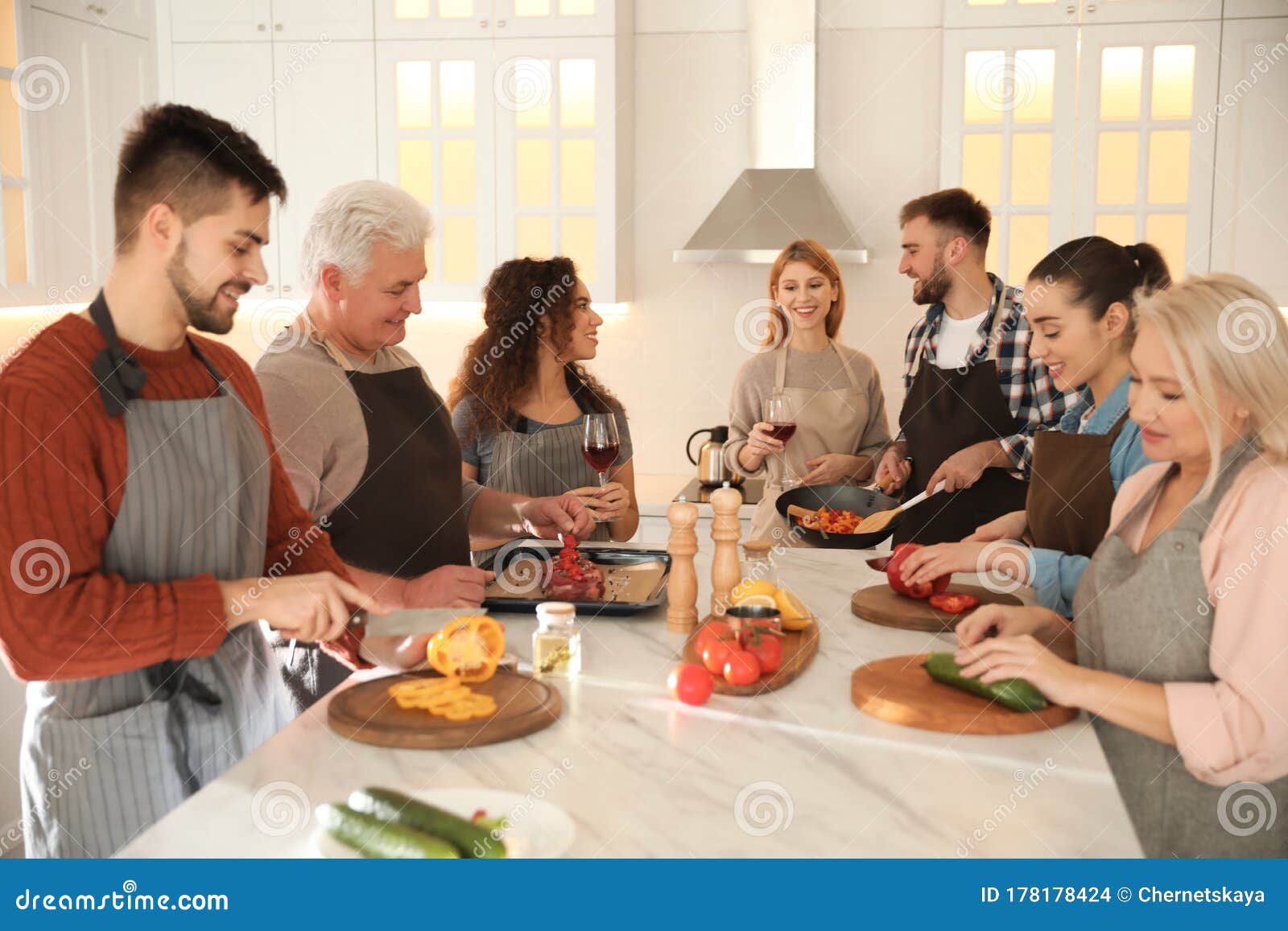 Happy People Cooking Food in Kitchen Stock Photo - Image of group ...