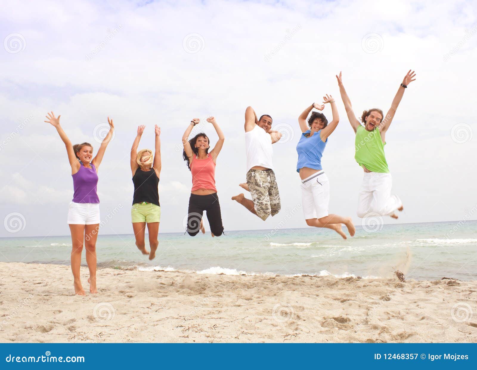Happy People Jumping on the Beach Stock Image - Image of lifestyle ...