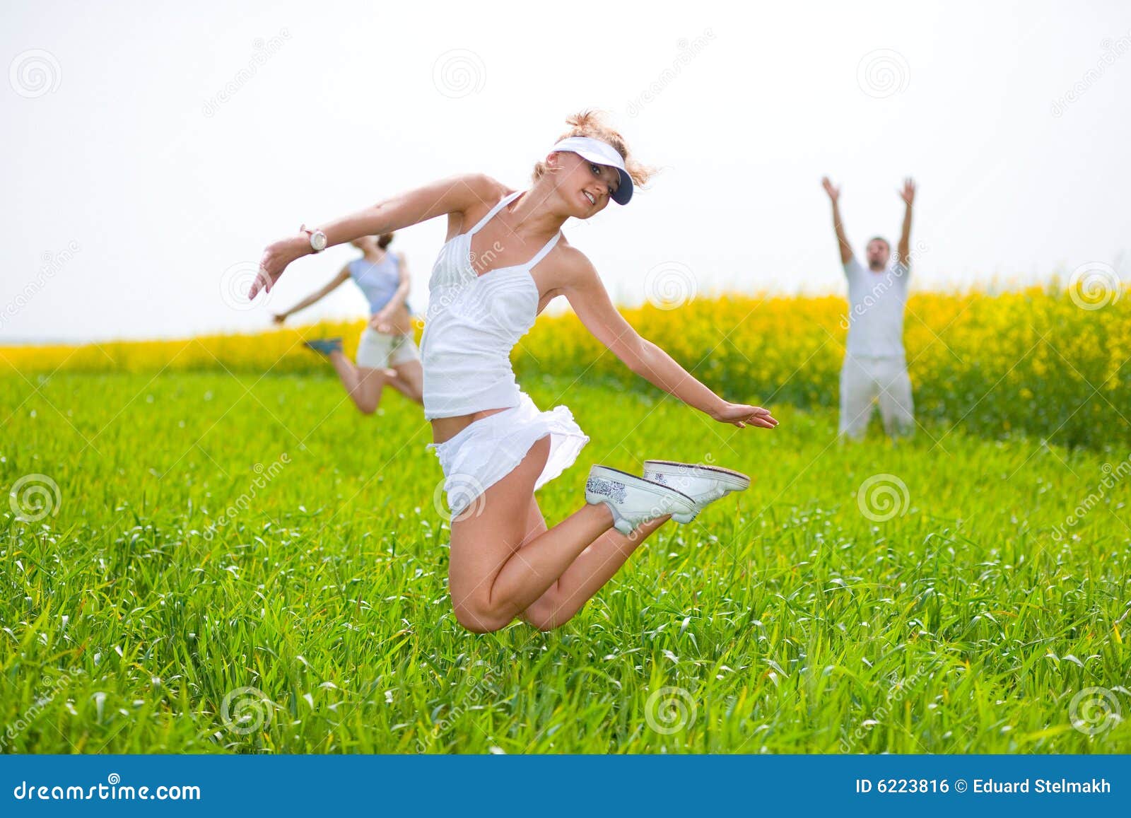 Happy People is Jumping in a Field Stock Photo - Image of happiness ...
