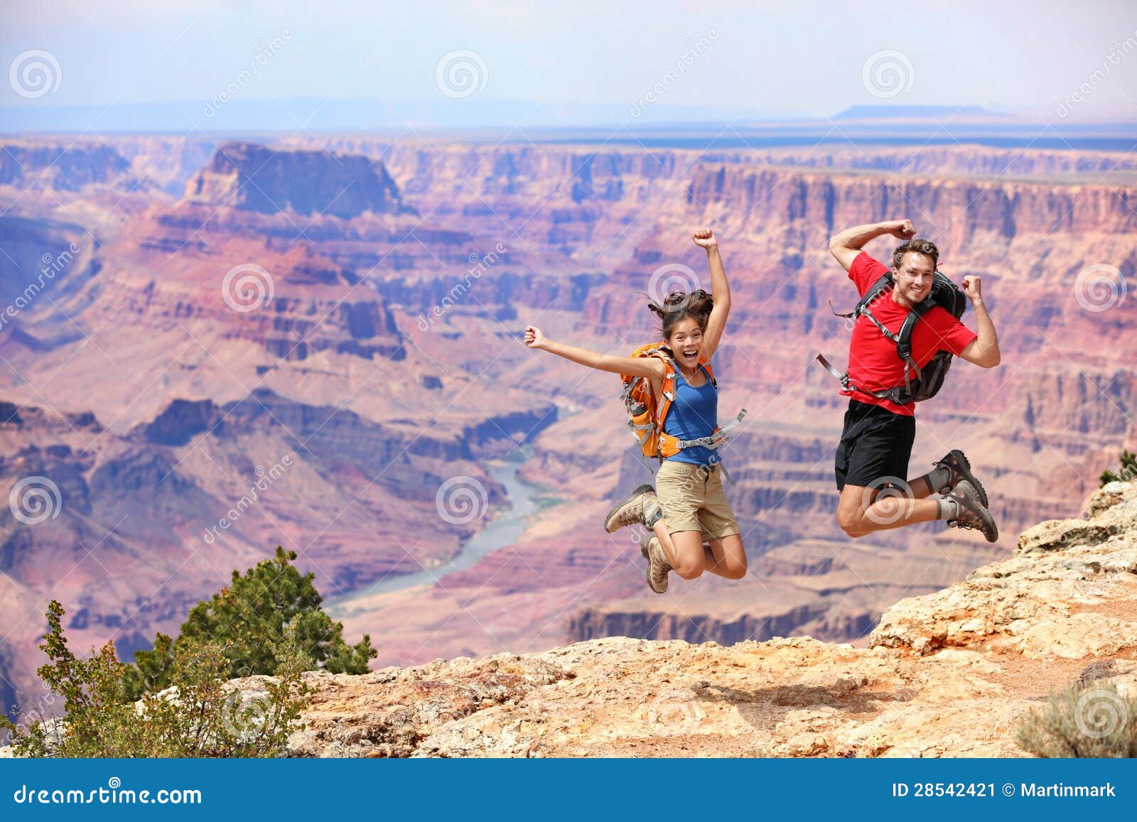 Happy People Jumping In Grand Canyon Stock Image - Image: 28542421