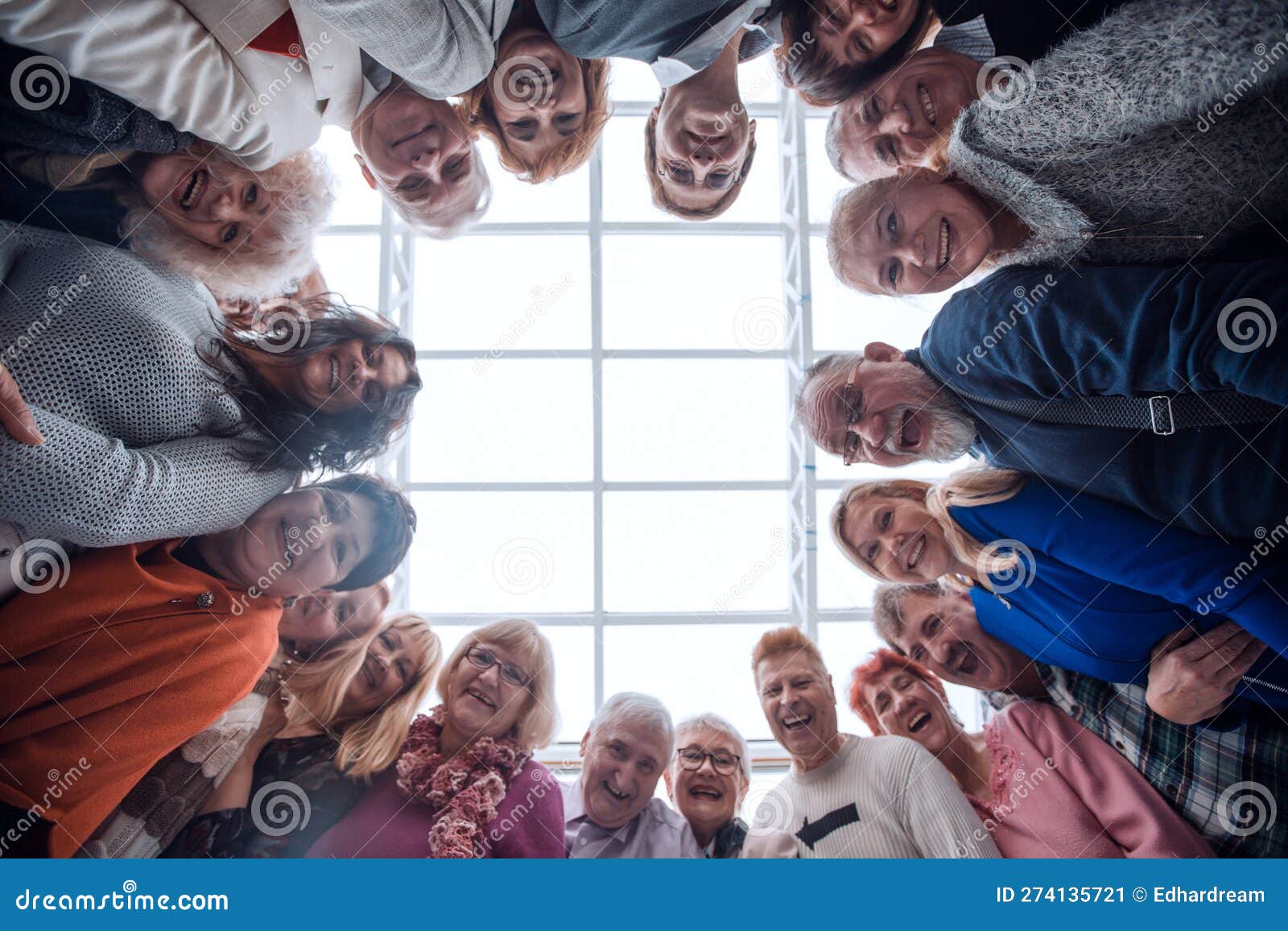 Happy People Looking Down at Camera Stock Image - Image of huddle ...
