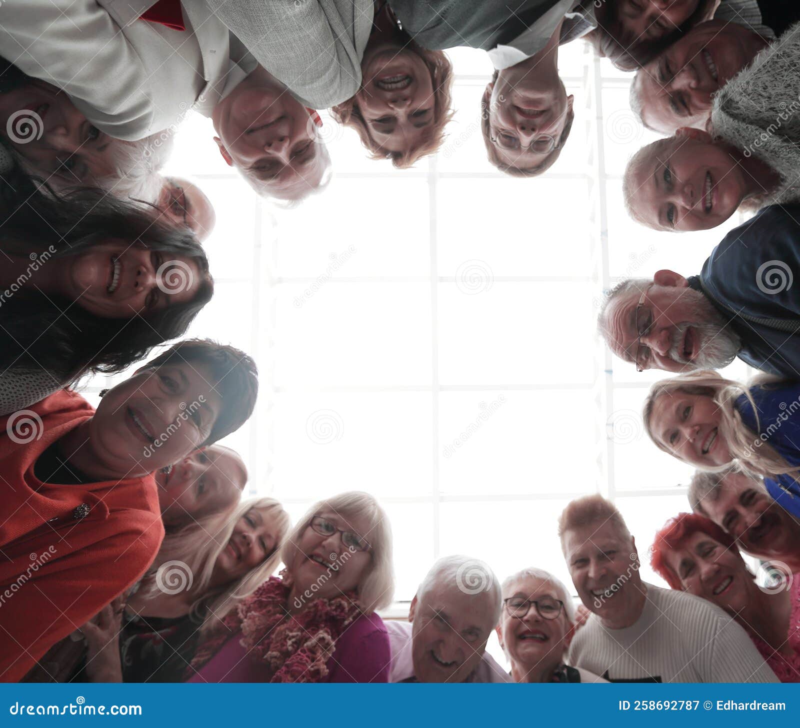 Happy People Looking Down at Camera Stock Image - Image of huddle ...