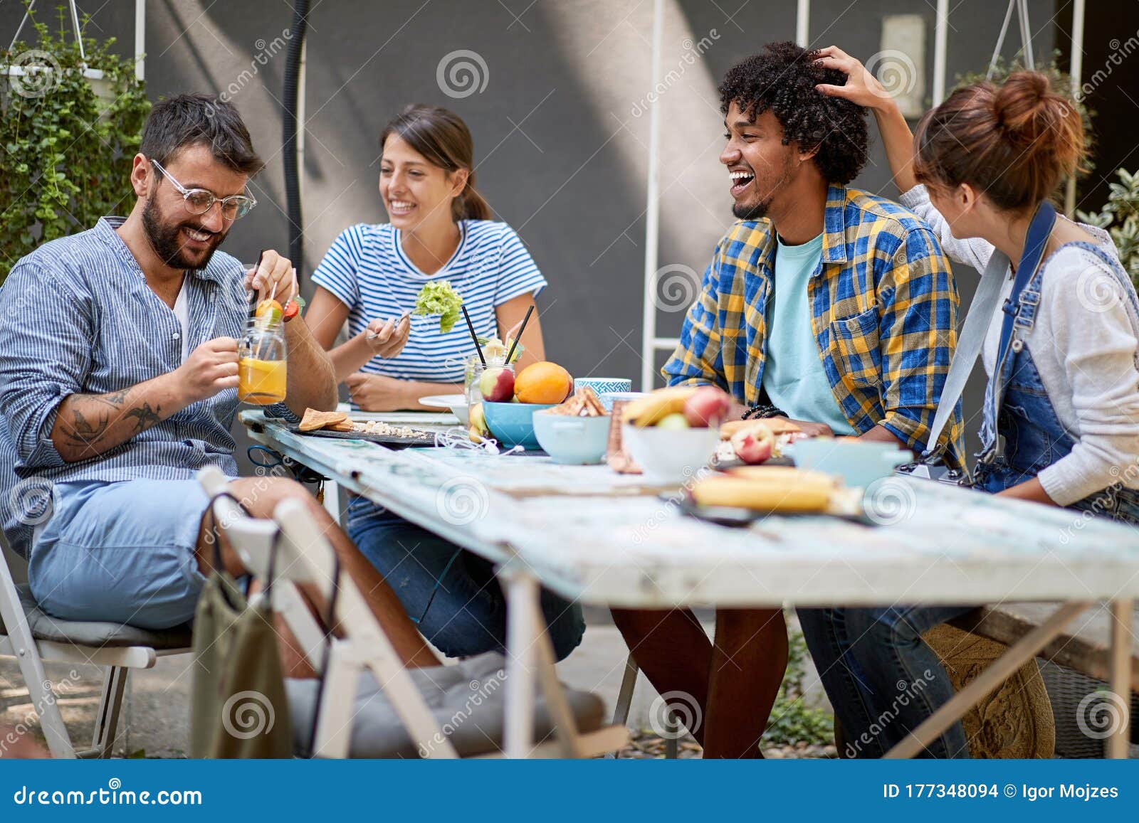 Happy People Talking while Having Snack Stock Photo - Image of adult ...