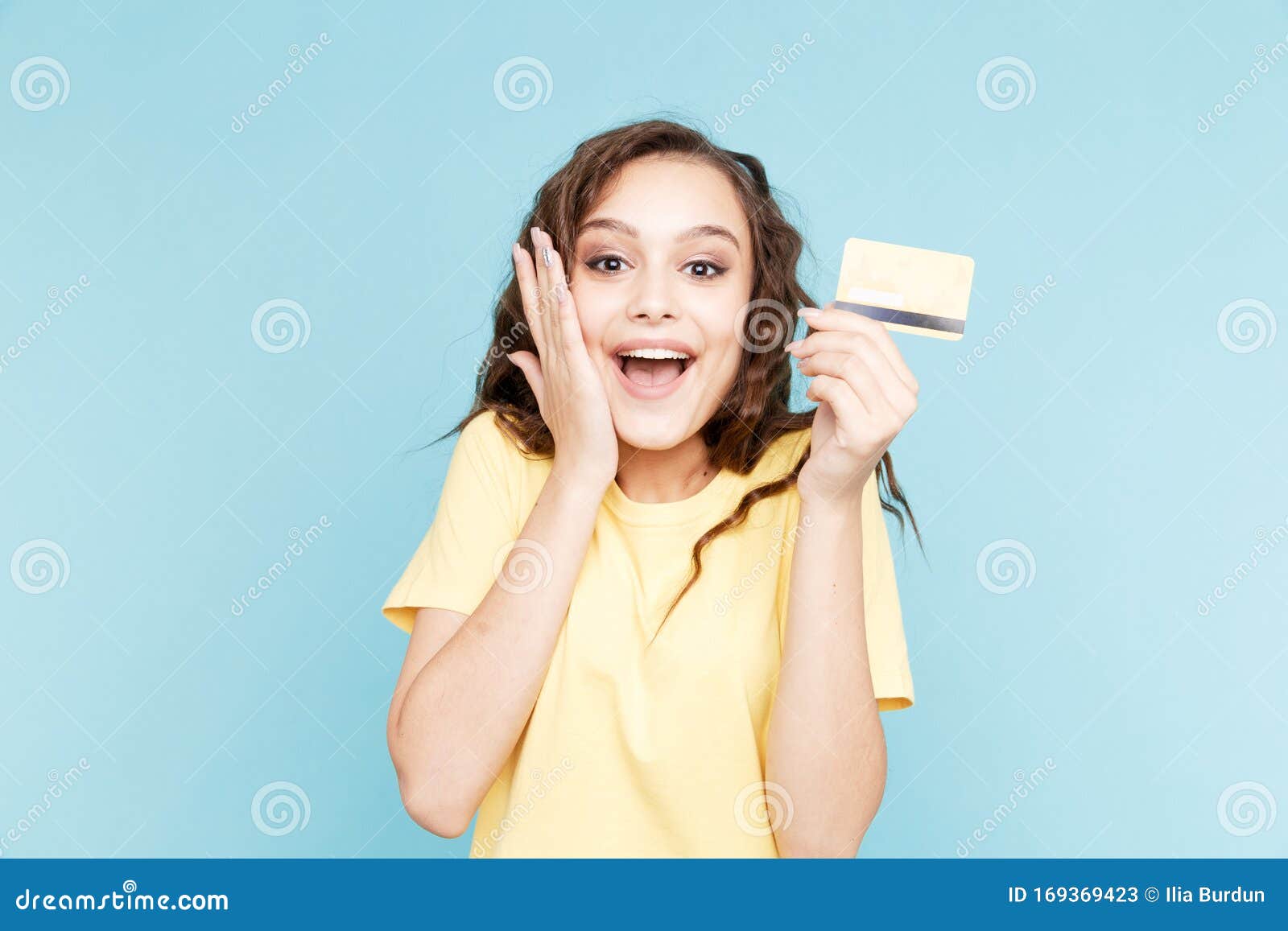 Happy Person with Credit Card Isolated in the Blue Studio. Stock Image ...