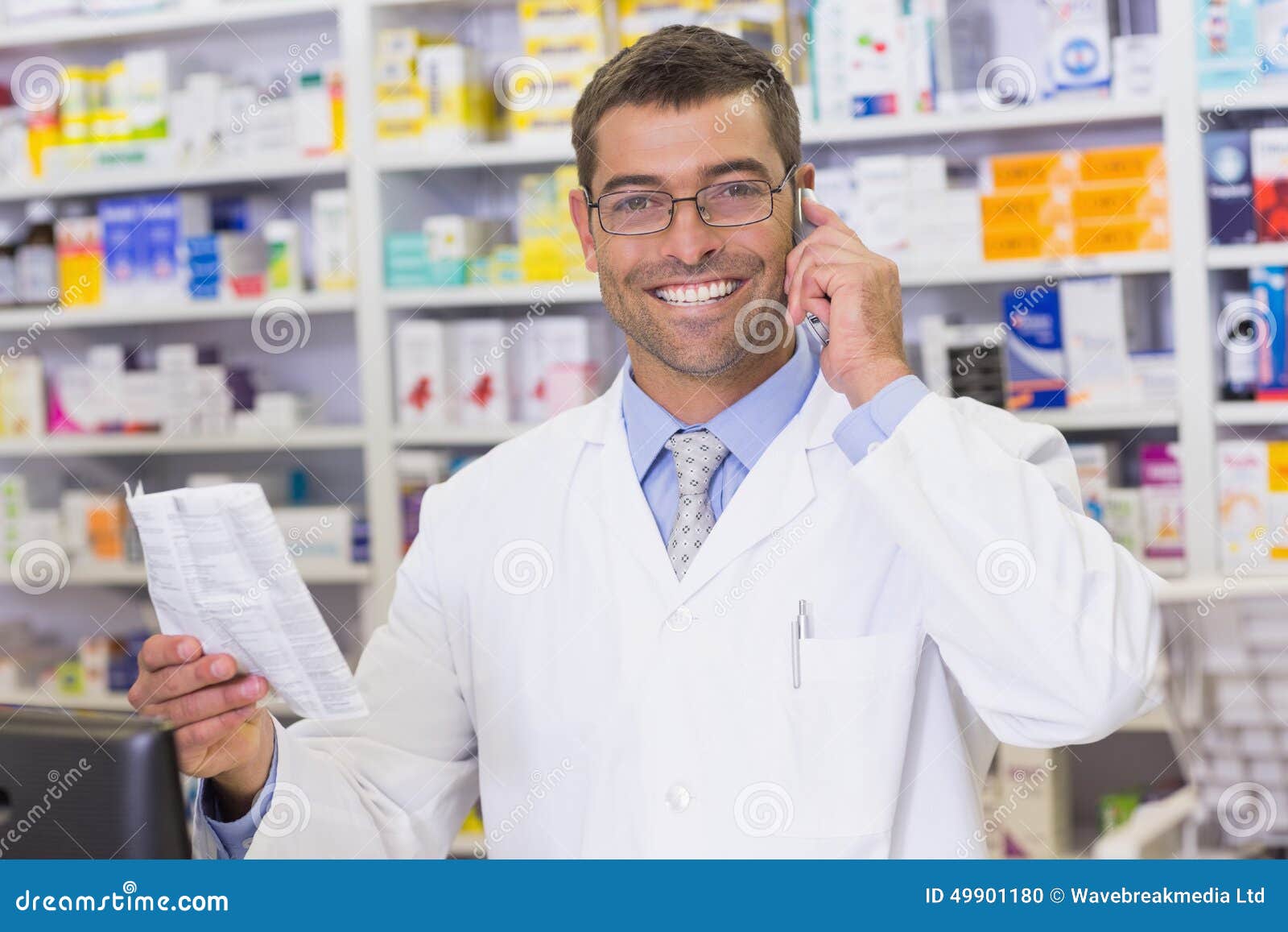 Happy Pharmacist on the Phone Looking at the Camera Stock Photo - Image ...