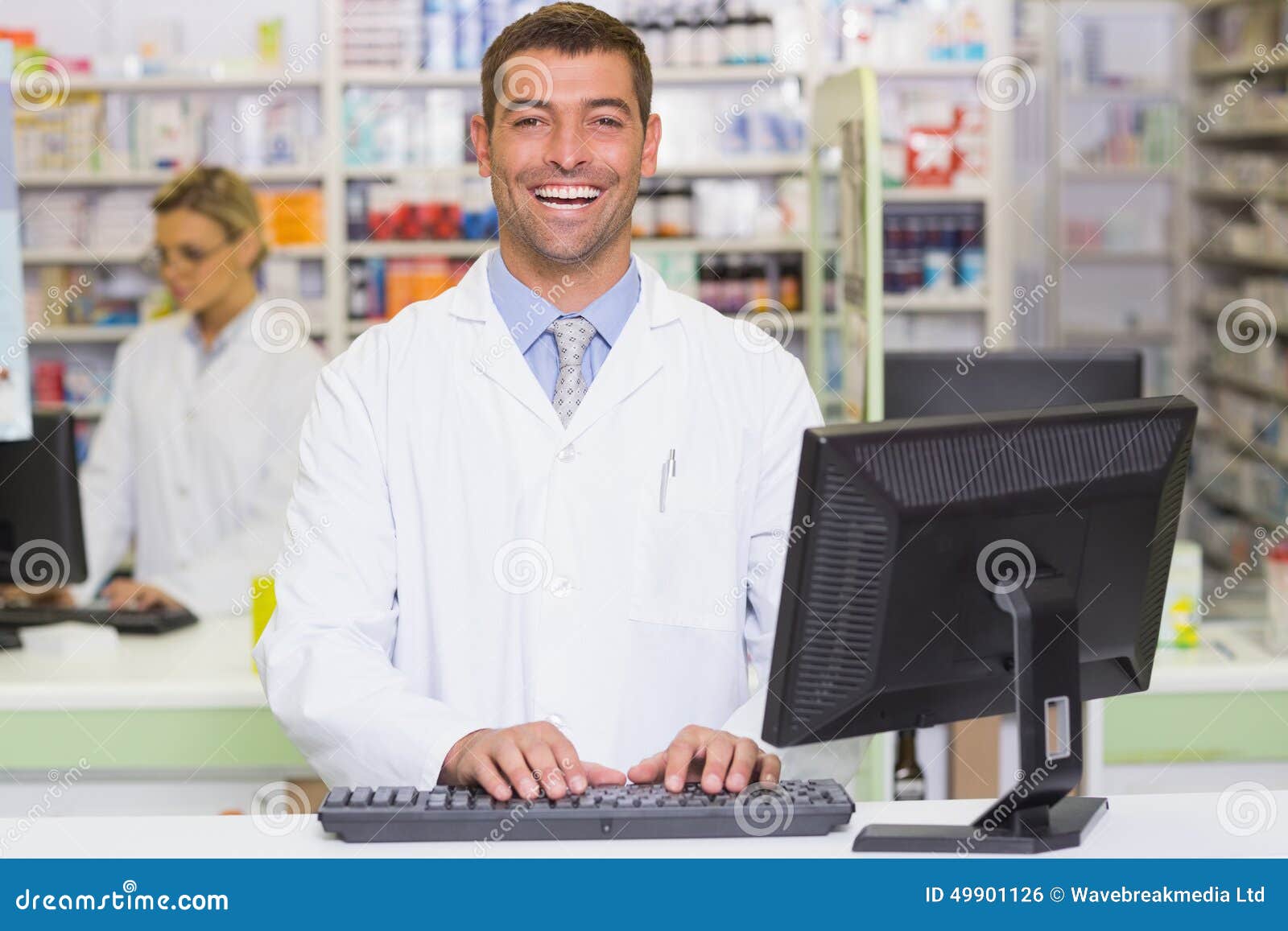 Happy Pharmacist Using Computer Stock Photo - Image of keyboard, people ...