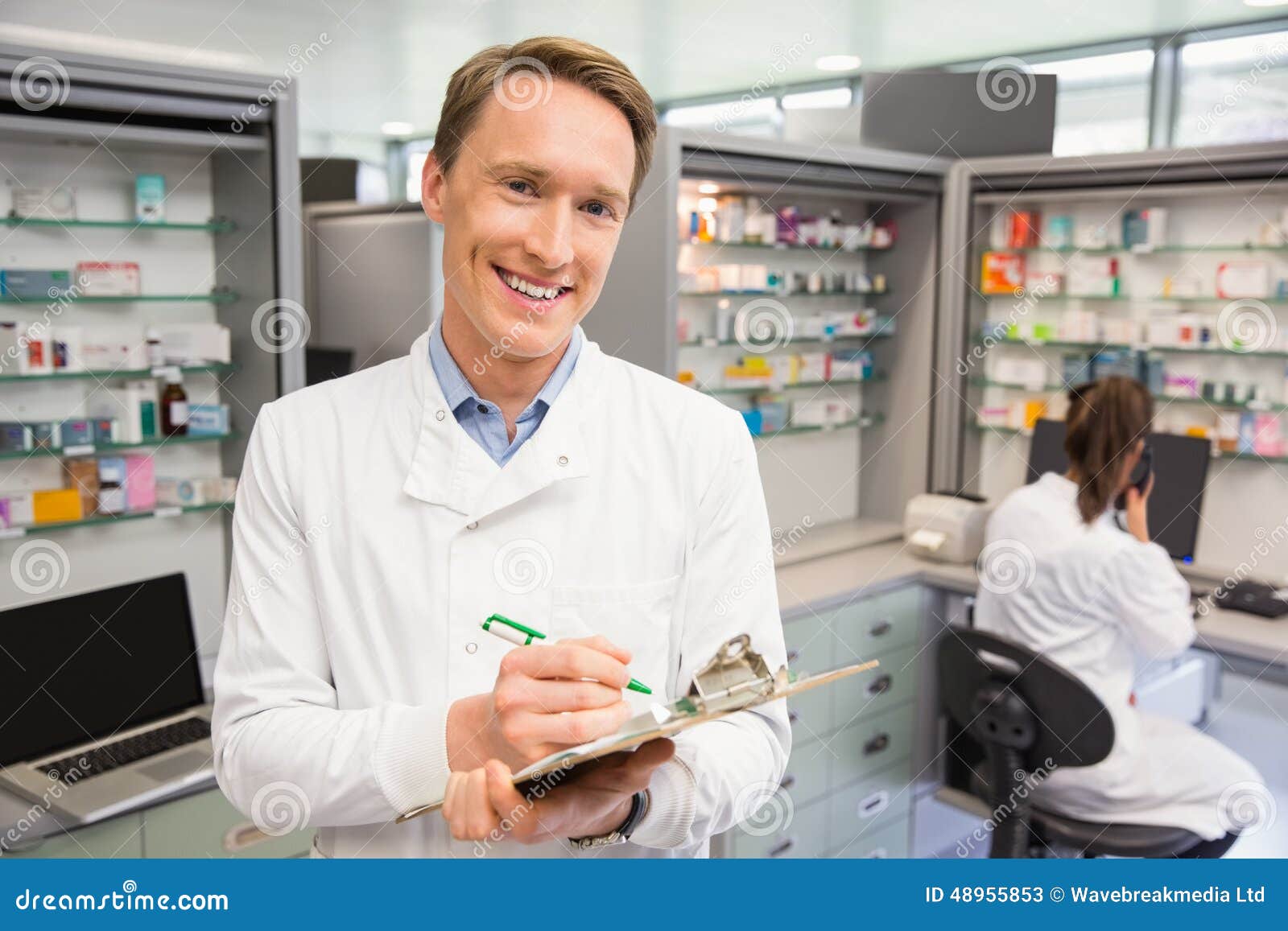 Happy Pharmacist Writing on Clipboard Stock Image - Image of caucasian ...