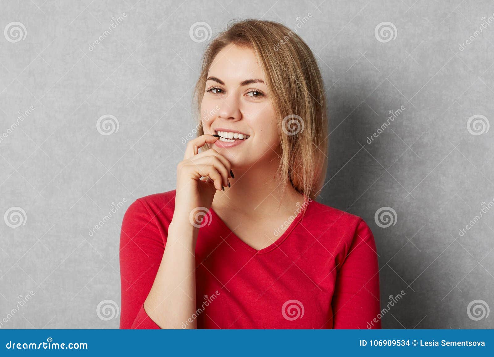 Happy Pleased Female Model Dressed in Red Clothes, Looks with Confident ...