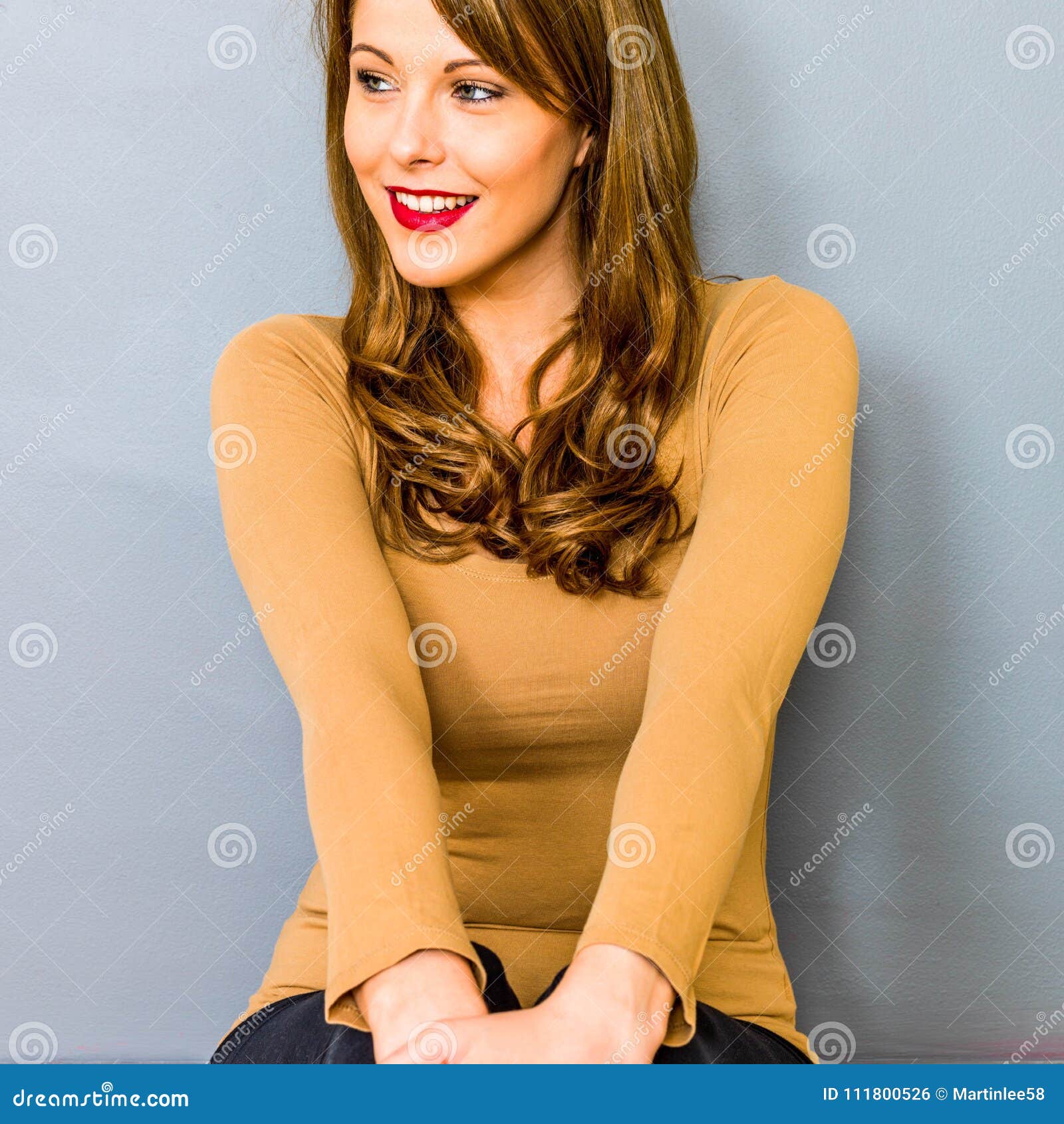 Happy Pleased Excited Young Woman Holding A Passport Sitting On An