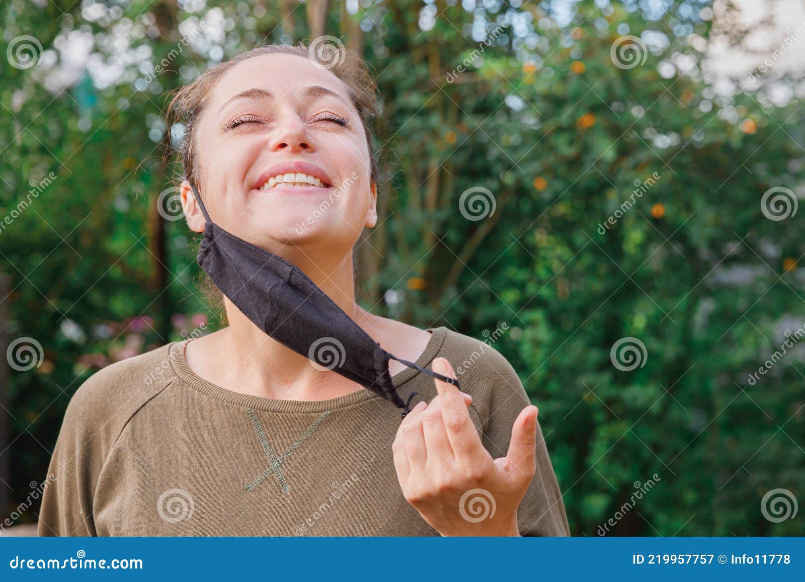 Happy Positive Girl Takes Off Protective Medical Mask From Face