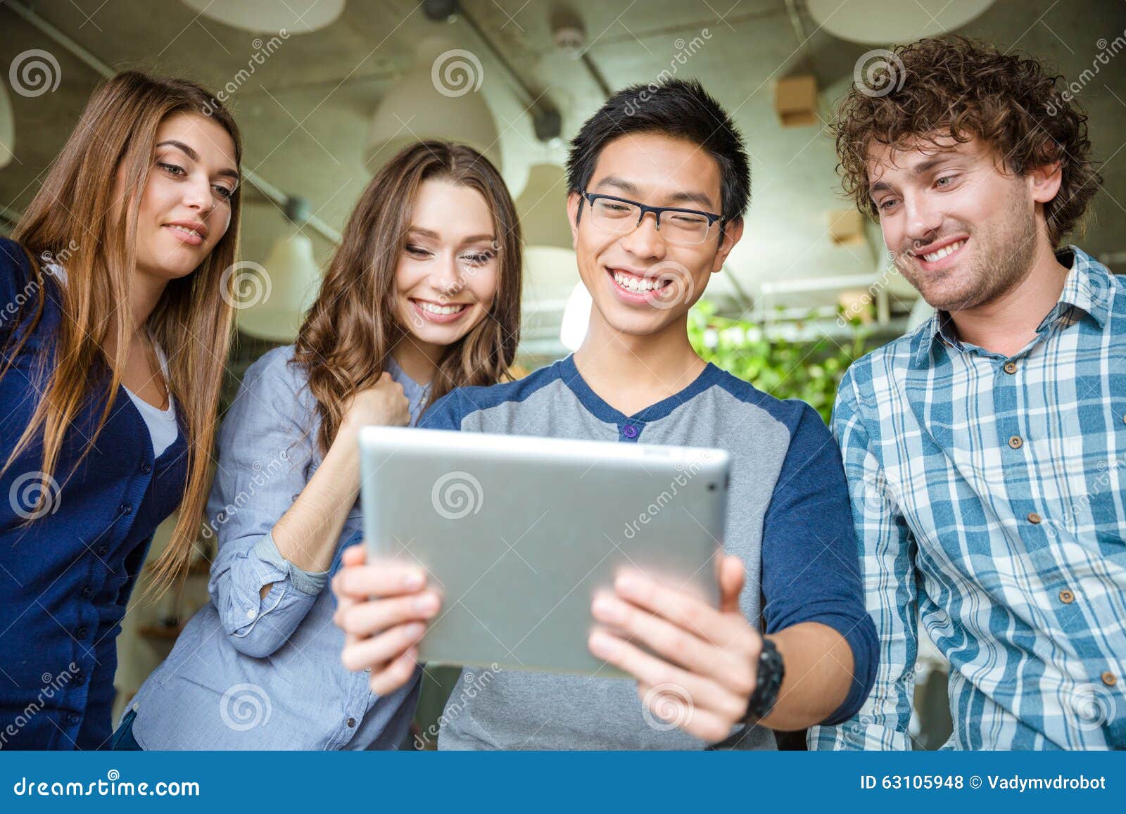 Happy Positive People Looking on the Screen of Tablet Stock Photo ...