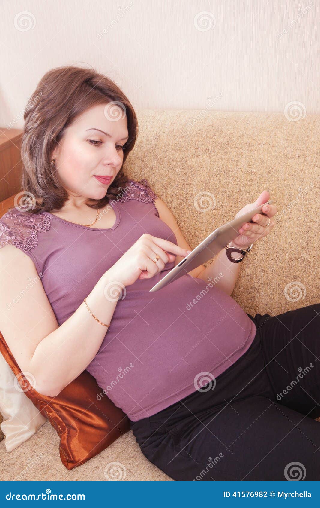 Happy Pregnant Woman Using a Digital Tablet Stock Photo - Image of ...