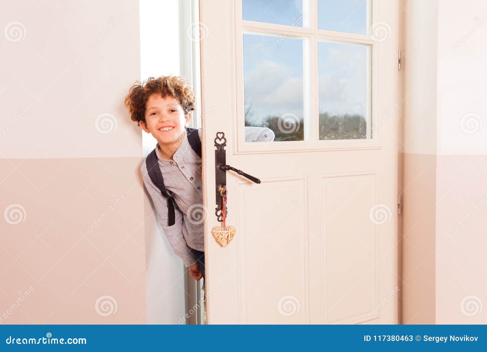 Happy Schoolboy Looking through the Doorway Stock Image - Image of ... Happy Schoolboy Looking through the Doorway Stock Image - Image of ...