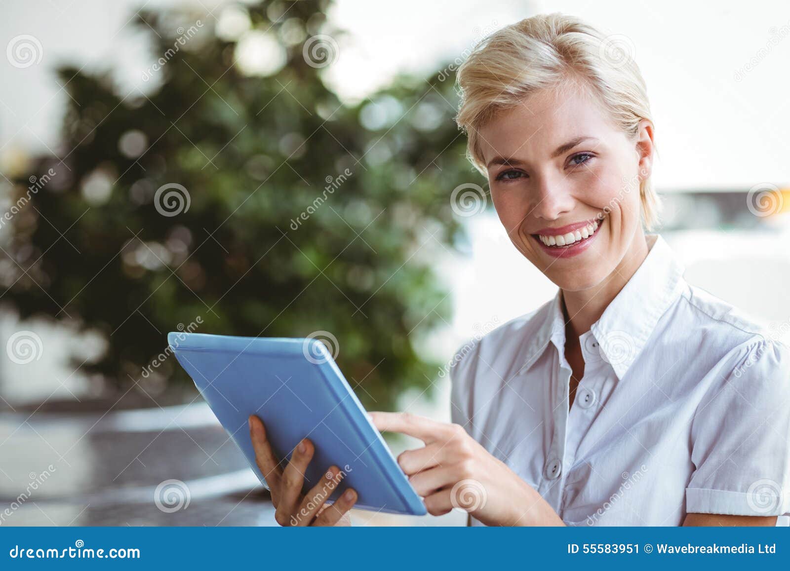 A Happy Pretty Blonde Using Tablet Computer Stock Image - Image of cafe ...