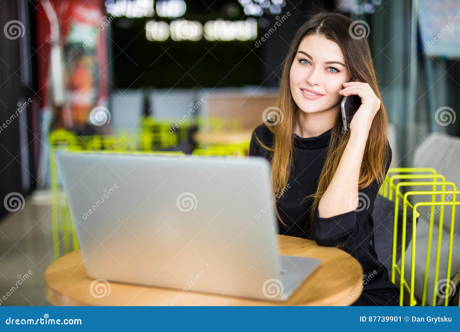 Happy Pretty Manager Talking on Mobile Phone with Client in Modern ...