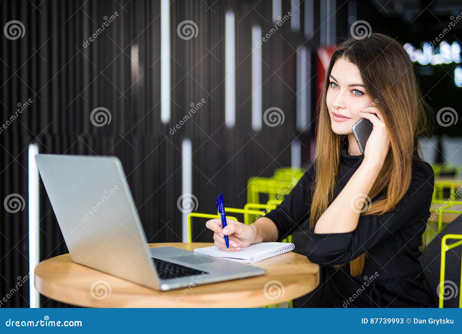 Happy Pretty Manager Talking on Mobile Phone with Client and Write ...