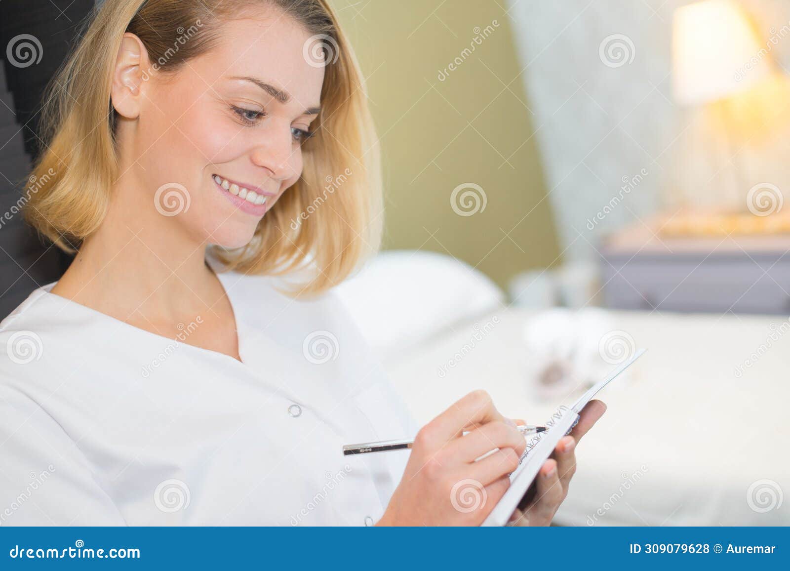Happy Pretty Young Nurse Taking Notes Stock Photo - Image of woman ...