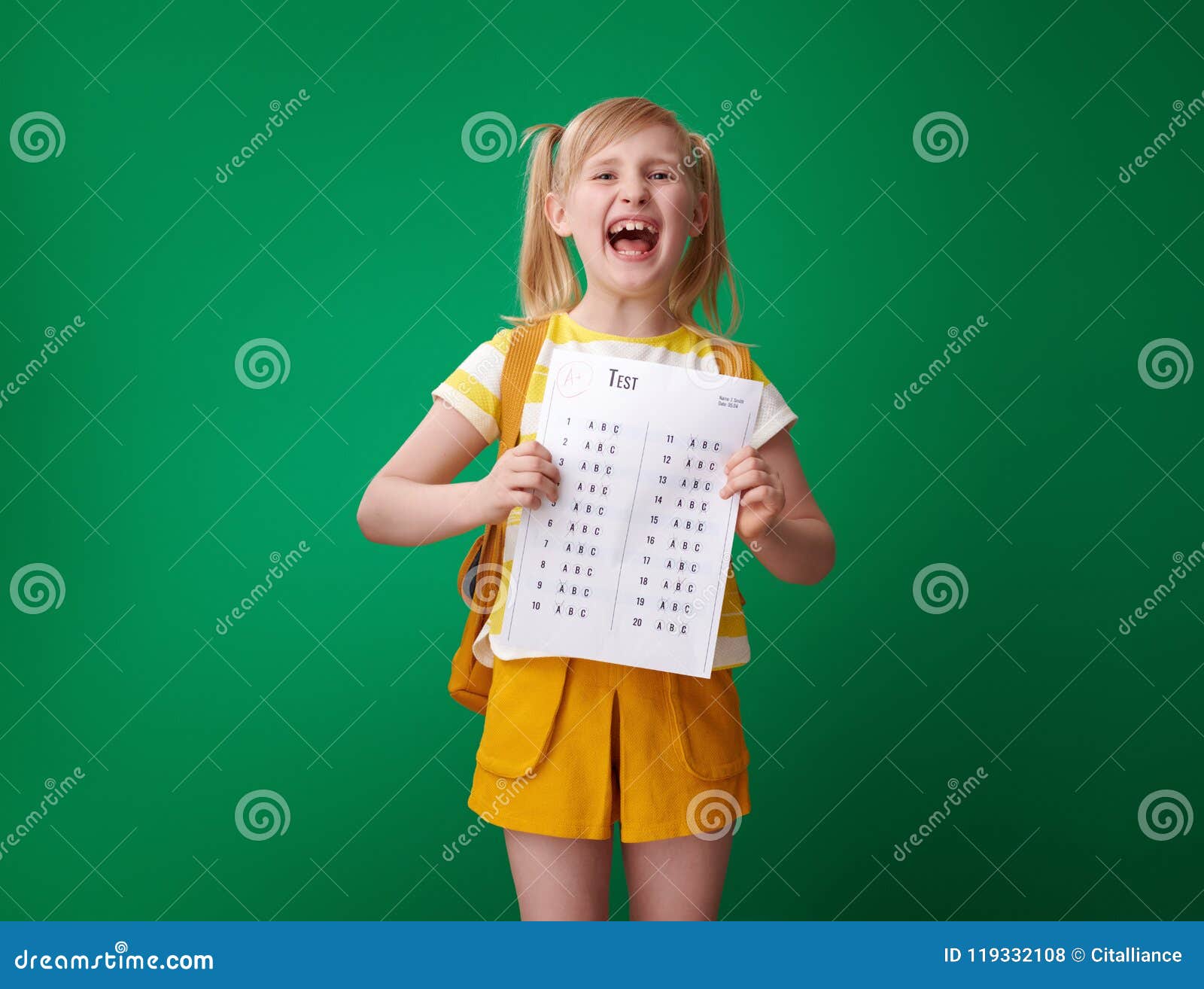 Happy Pupil Holding Excellent Grade Test Isolated on Green Stock Photo ...