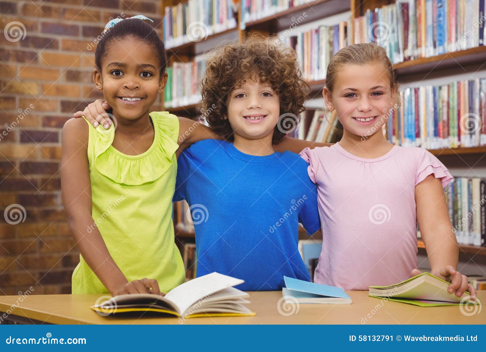 Happy Pupils Reading a Library Book Stock Image - Image of desk, male ...