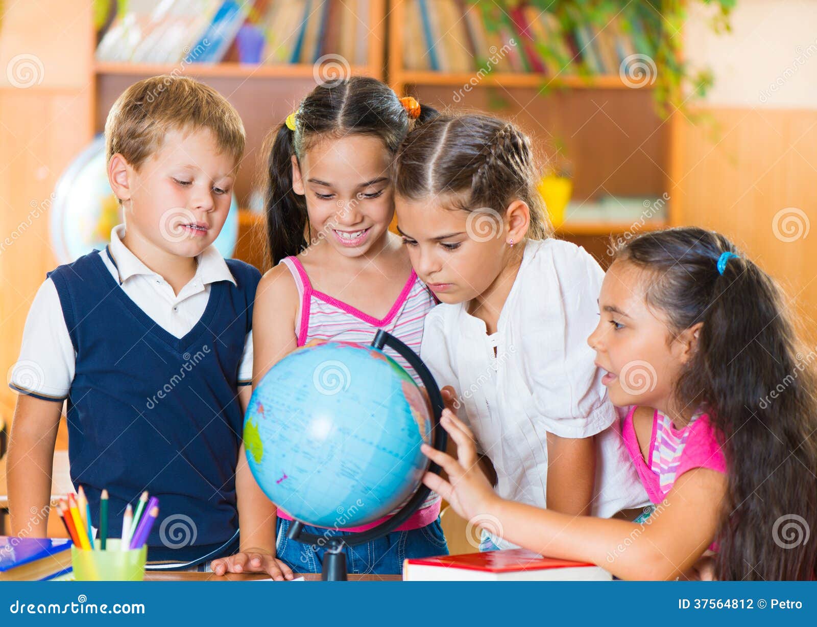 Happy pupils at school stock photo. Image of globe, group - 37564812