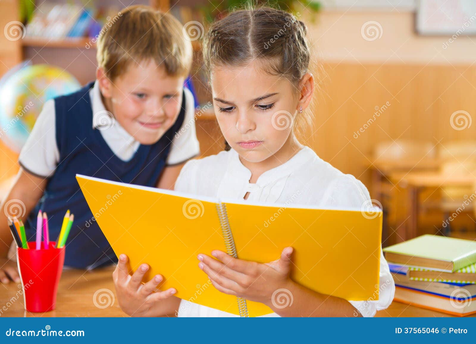 Happy pupils at school stock photo. Image of literature - 37565046