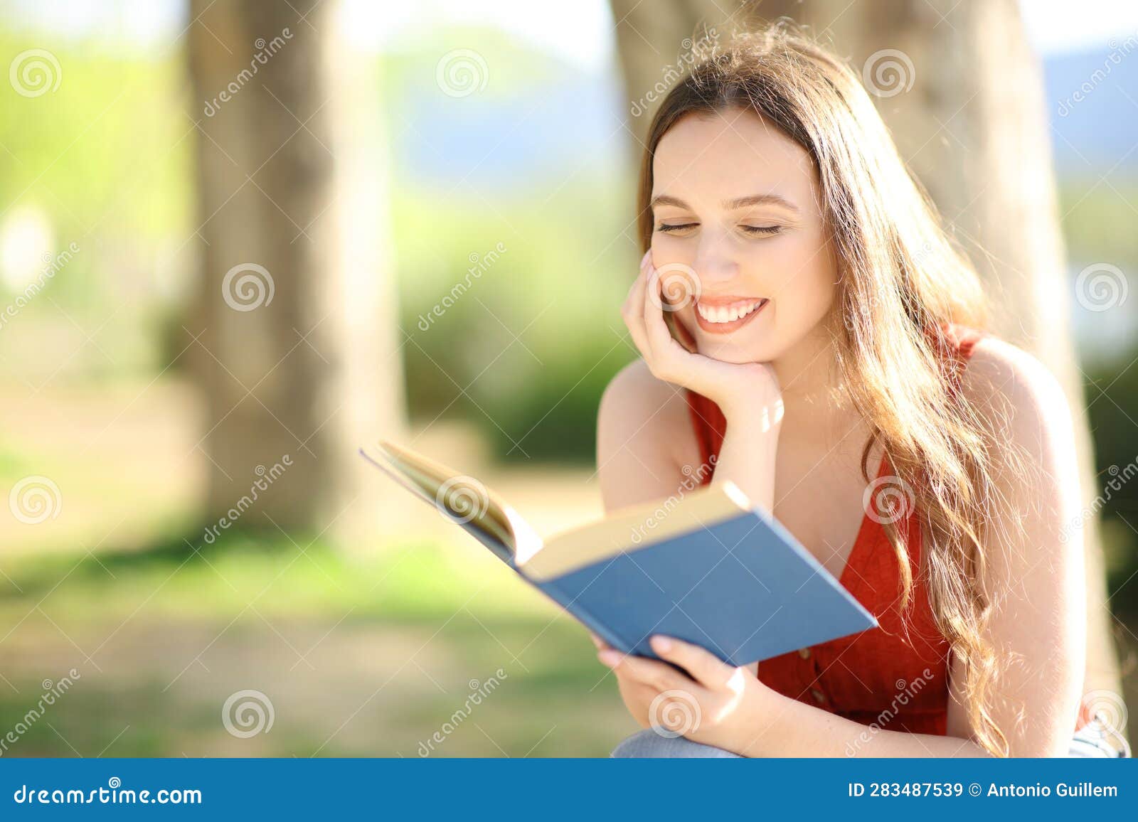 Happy Reader Reading a Paper Book in Nature Stock Image - Image of ...
