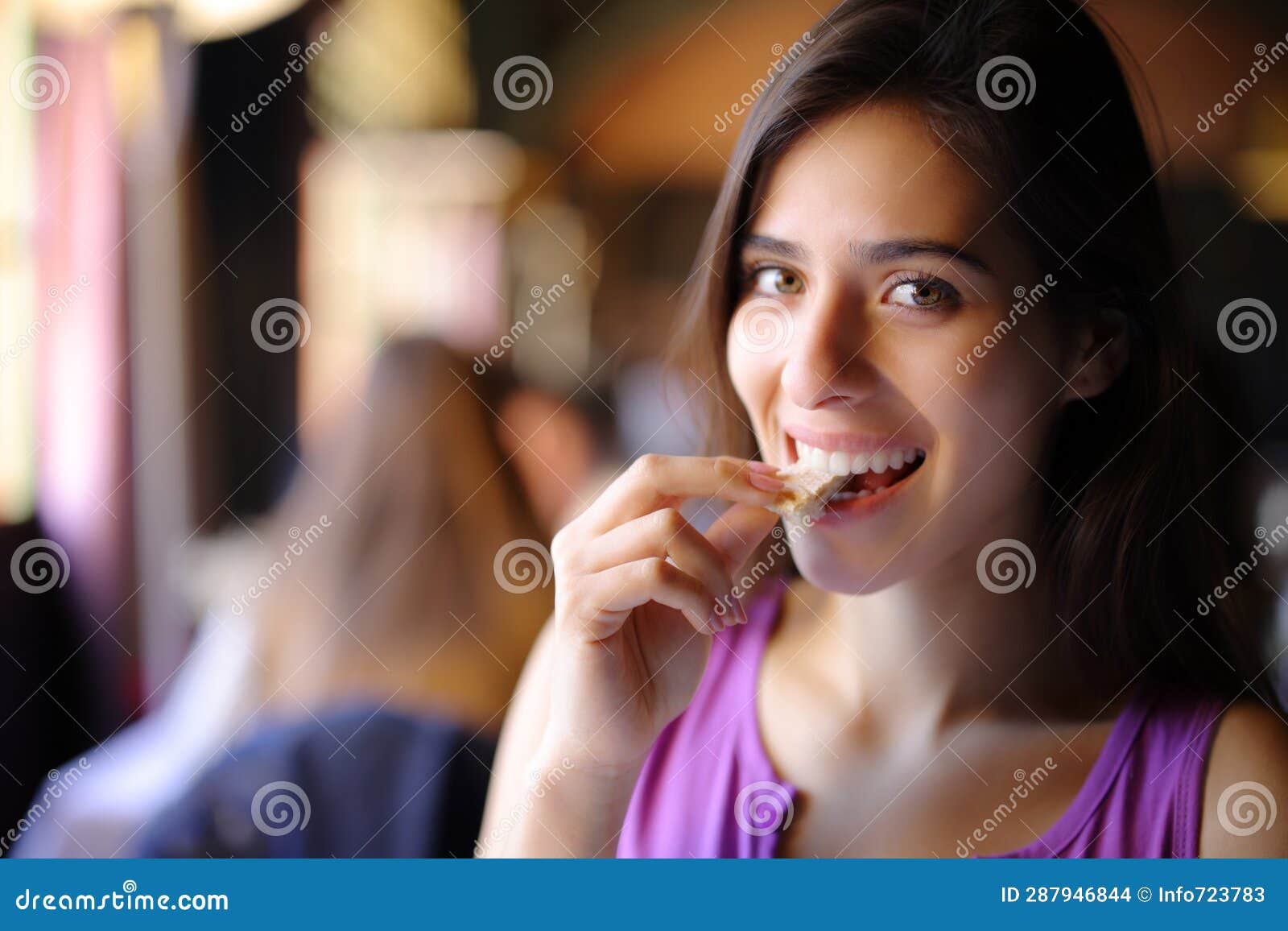 Happy Restaurant Customer Eating Bread Looking at You Stock Photo ...