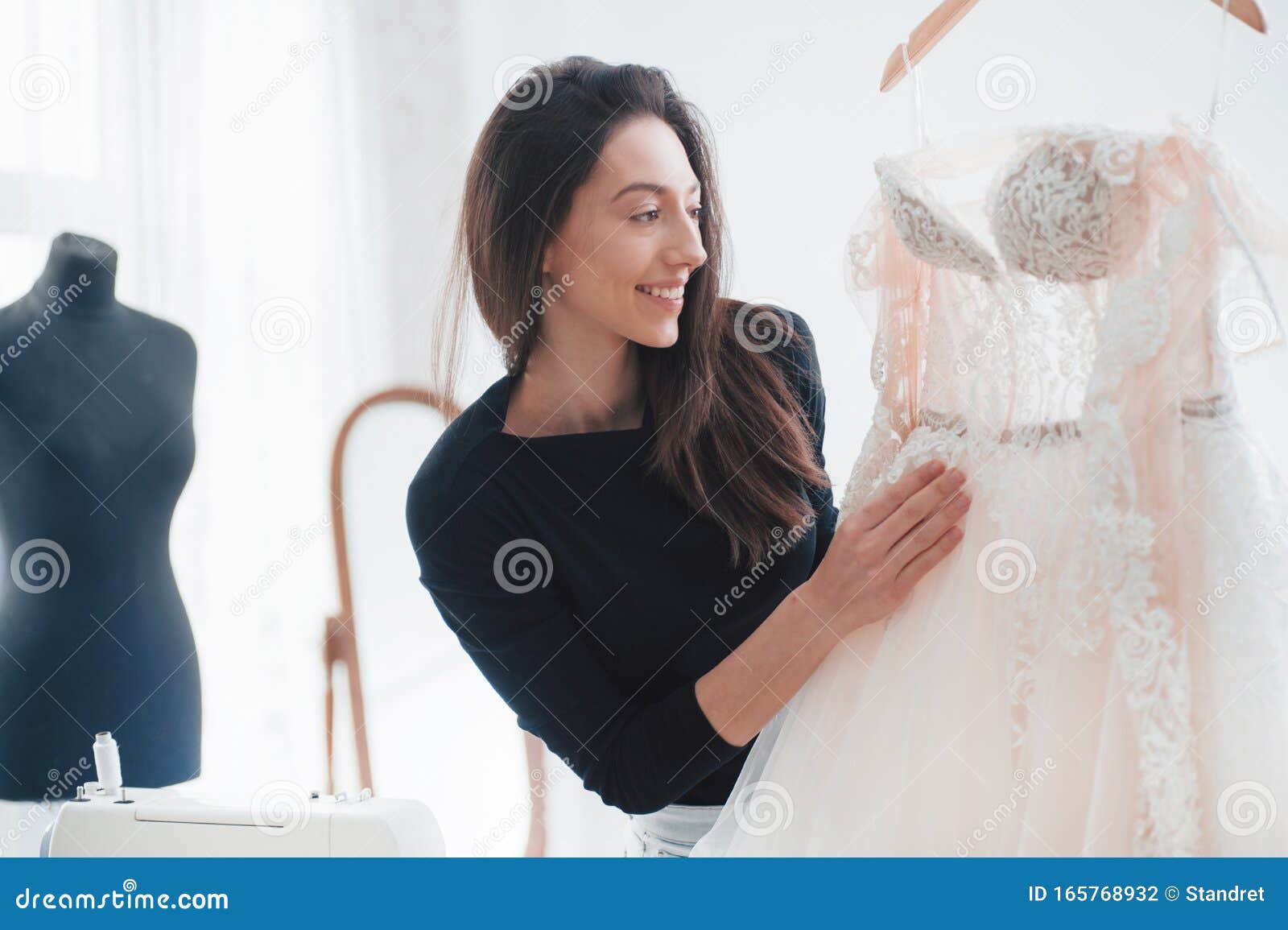 Happy with Result. the Process of Fitting the Dress in the Studio of ...