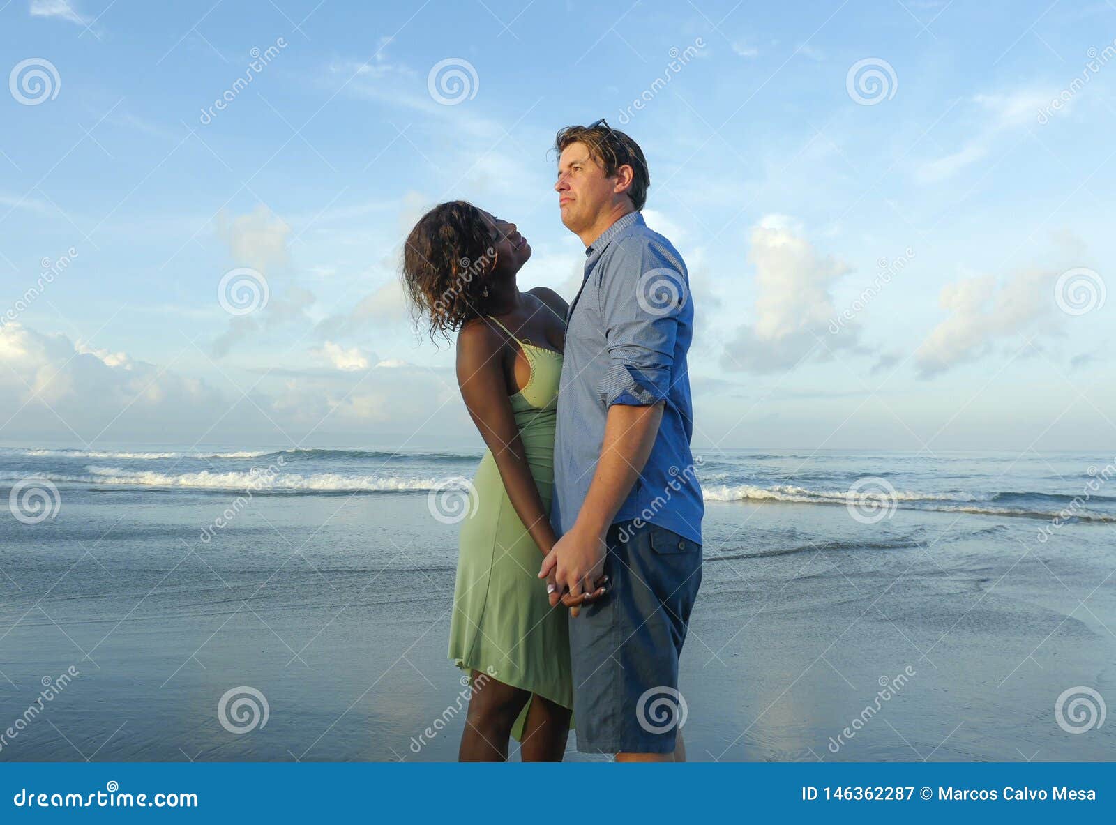 Happy And Romantic Mixed Race Couple With Attractive Black African