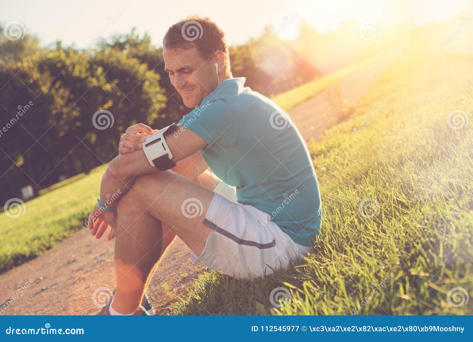 Happy Runner Checking His Training Results on Smartphone Stock Image ...
