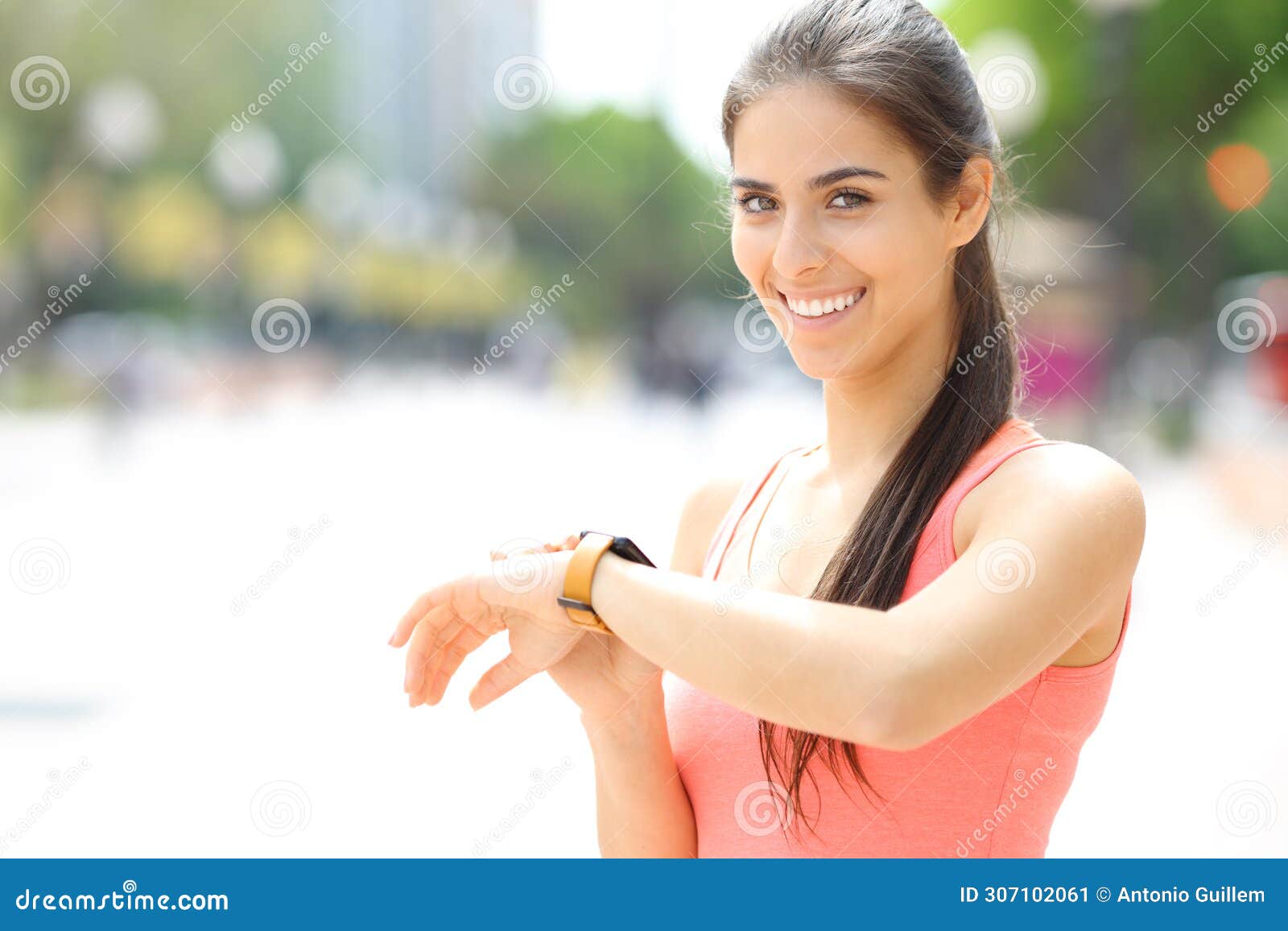 Happy Runner Checking Smartwatch Looking at You Stock Image - Image of ...