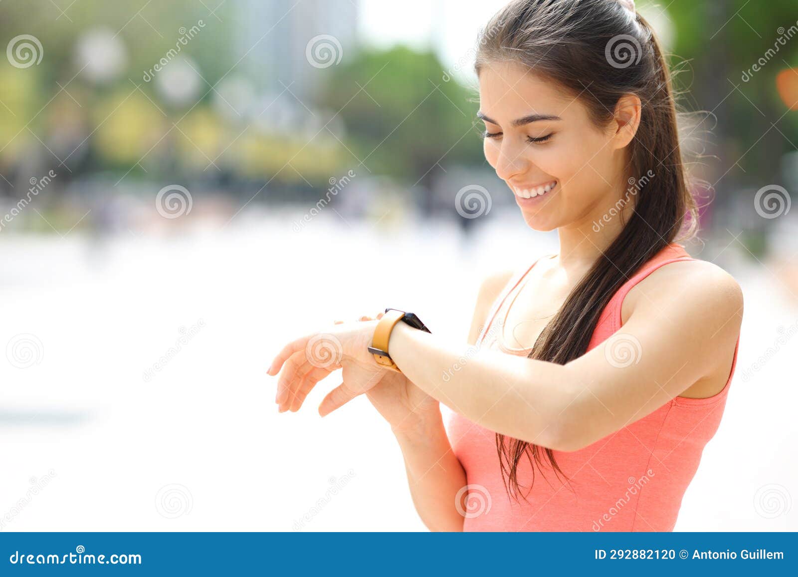 Happy Runner Checking Time in Smartwatch Stock Photo - Image of ...