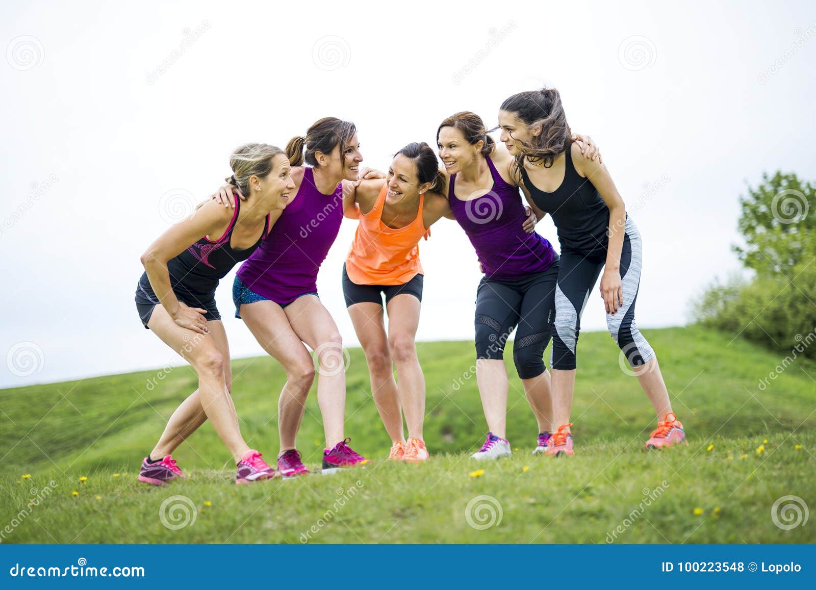 Happy Running Team on the Grass Stock Photo - Image of competitive ...