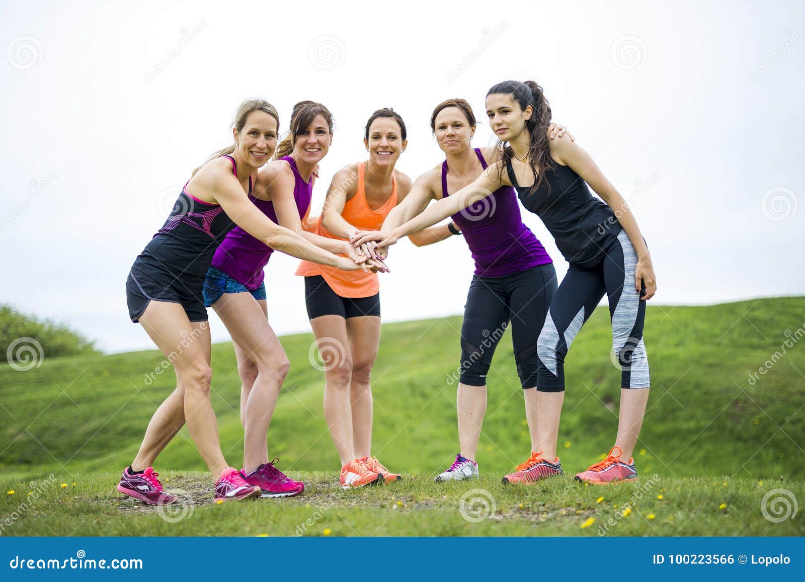 Happy Running Team on the Grass Stock Photo - Image of endurance, space ...