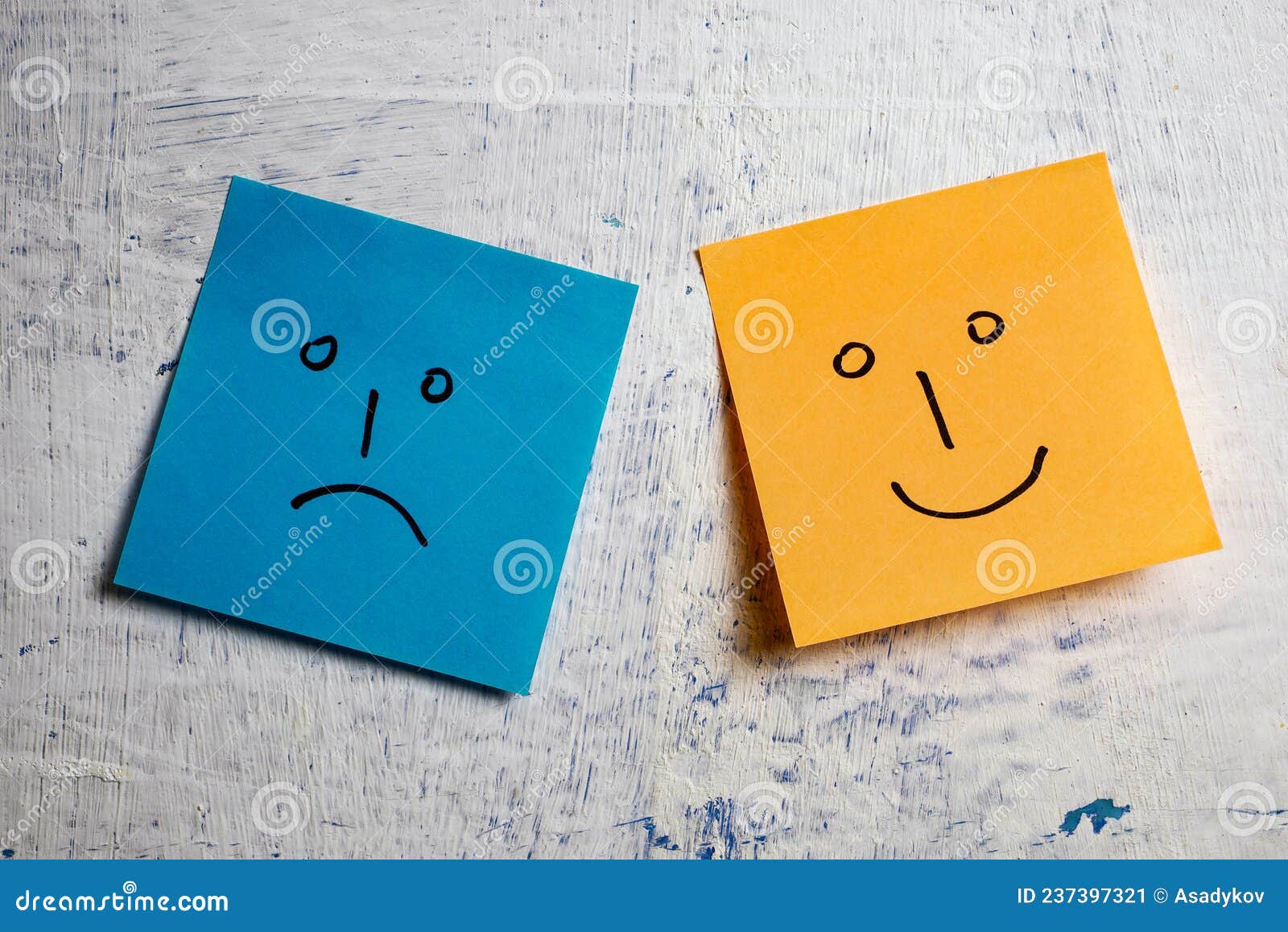 Happy And Sad Faces Hand Drawn On Sticky Notes On Painted Wall Stock ...