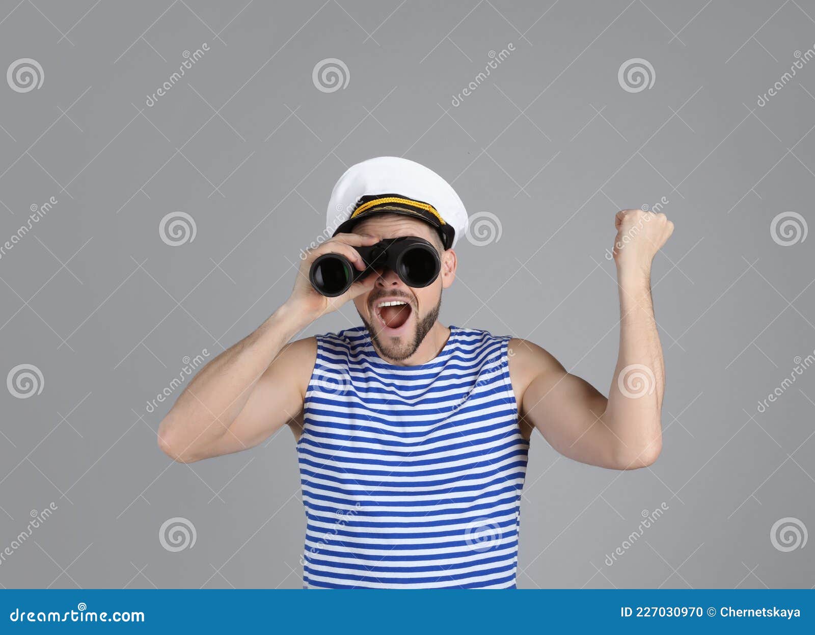 Happy Sailor Looking through Binoculars on Grey Background Stock Photo ...