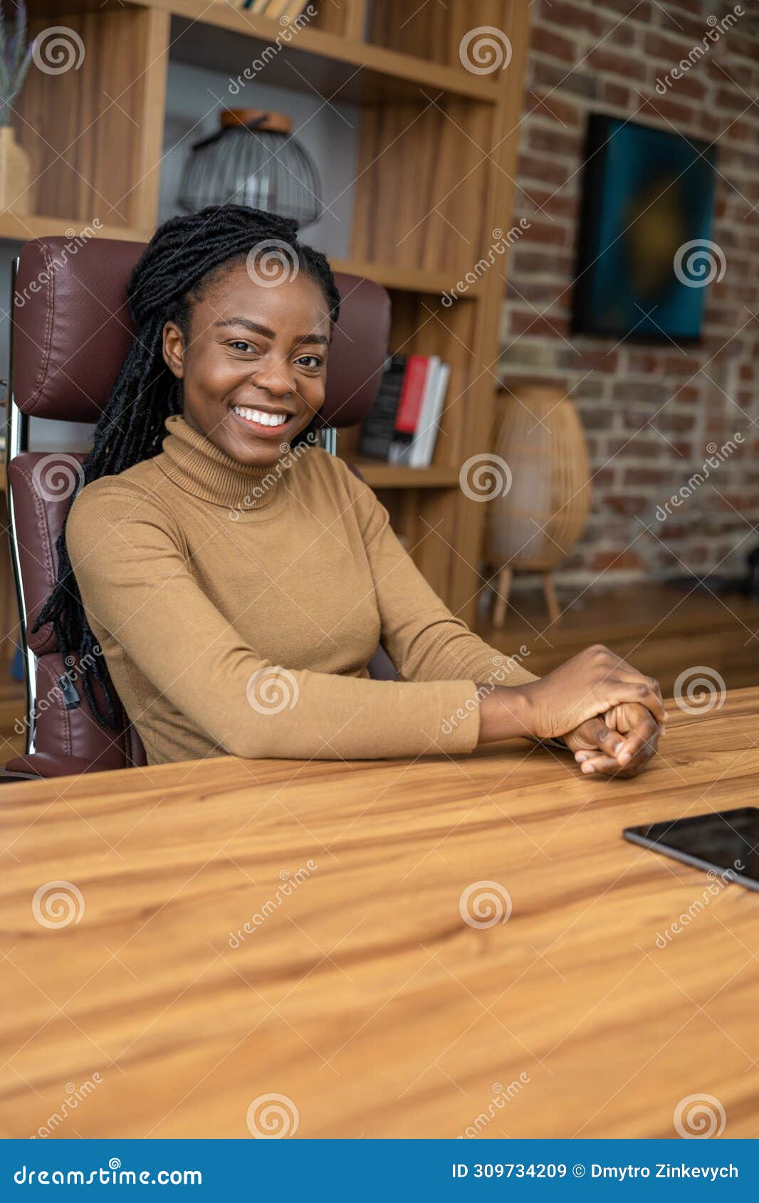 Happy Satisfied Multicultural Woman Sitting at Table in Office Interior ...