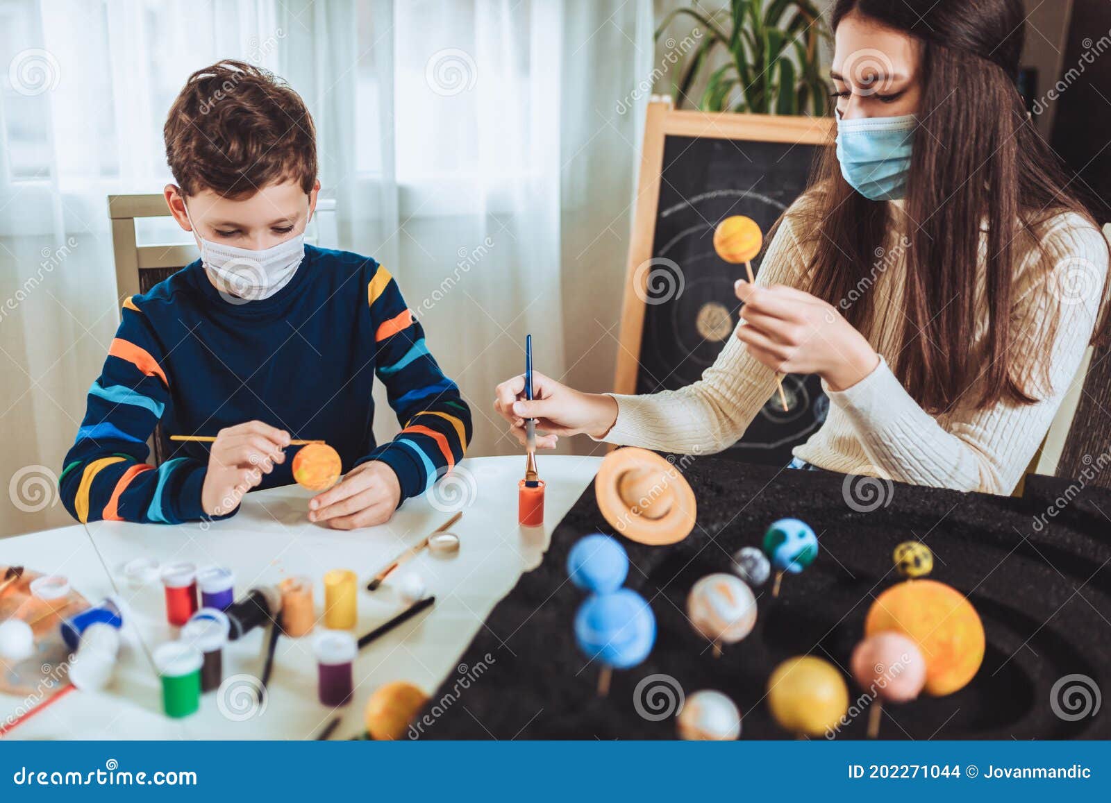 School Boy and Girl with Protective Mask Making a Solar System for a ...