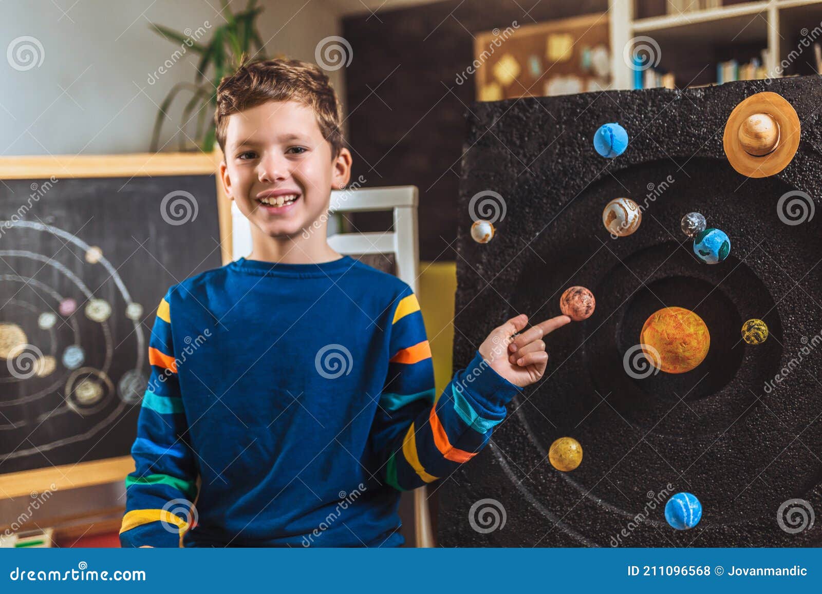 School Boy Making a Solar System for a School Science Project at Home ...