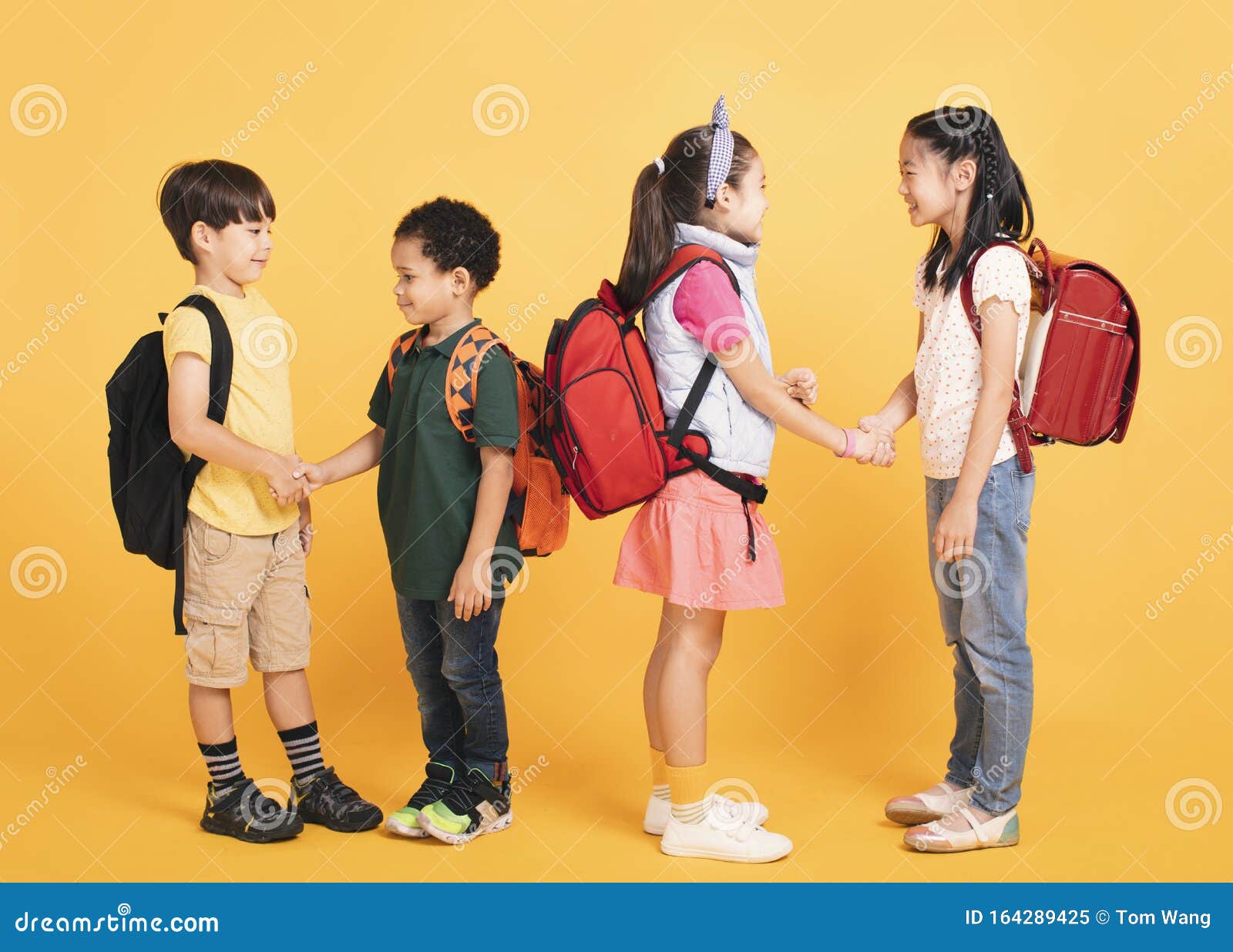 Happy School Children Handshaking Together Stock Image - Image of ...