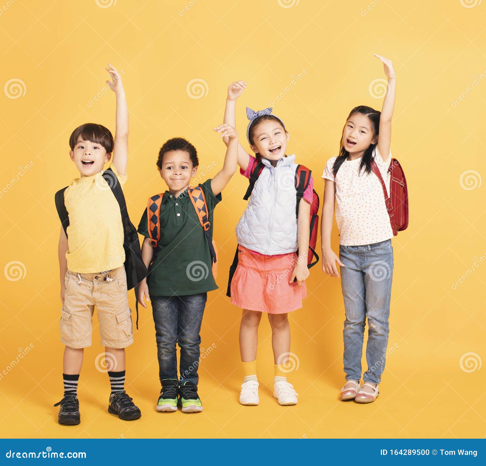Happy School Children Raised Hands Together Stock Photo - Image of face ...