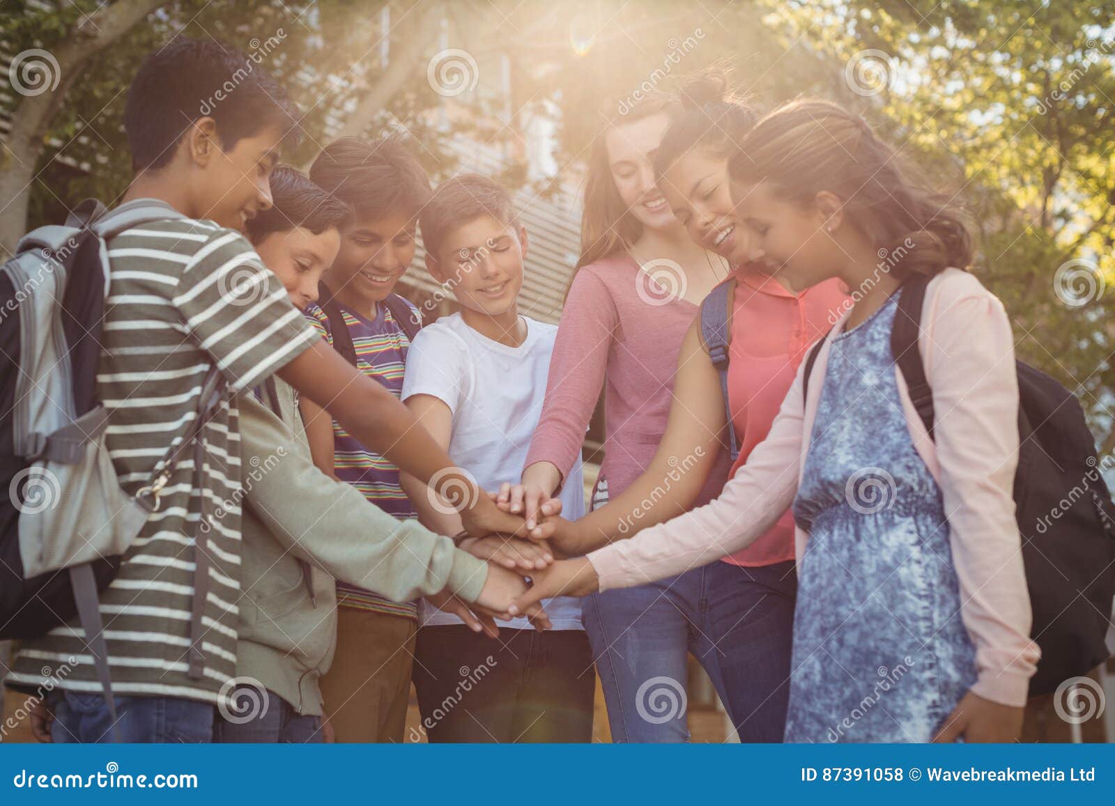 Happy School Kids Forming Hand Stack in Campus Stock Photo - Image of ...