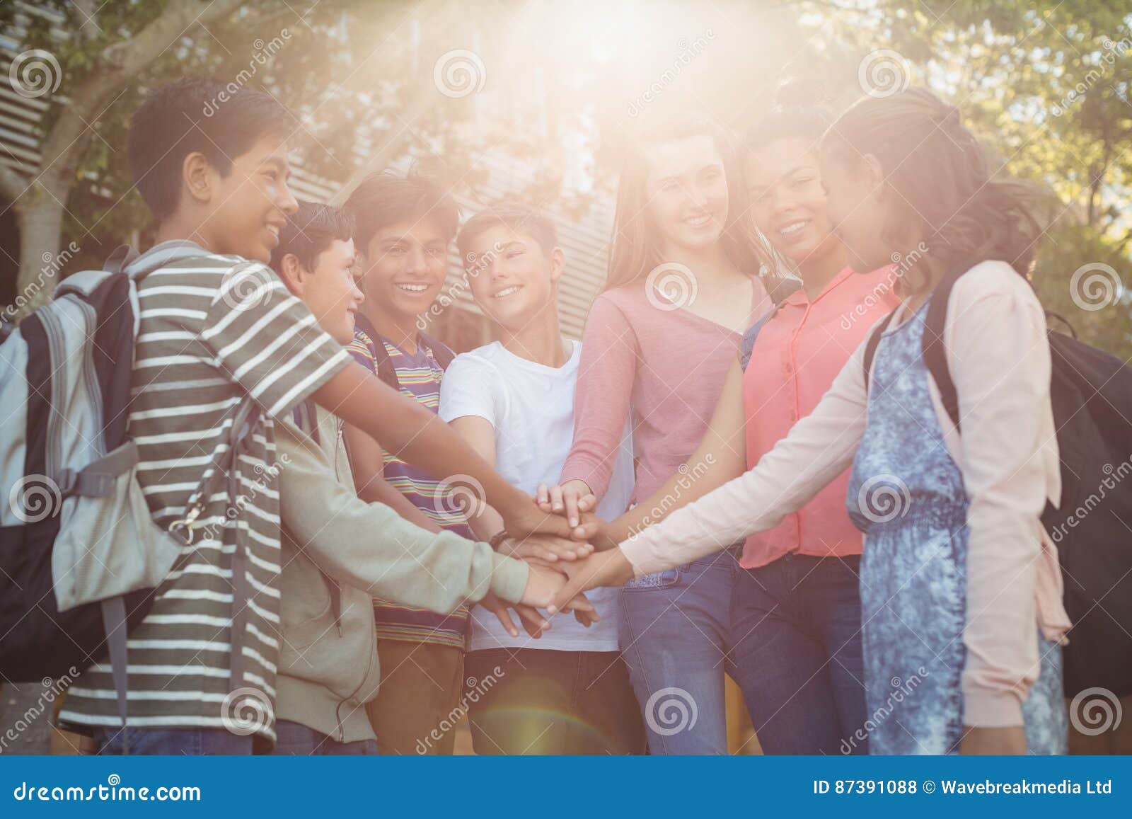 Happy School Kids Forming Hand Stack in Campus Stock Photo - Image of ...