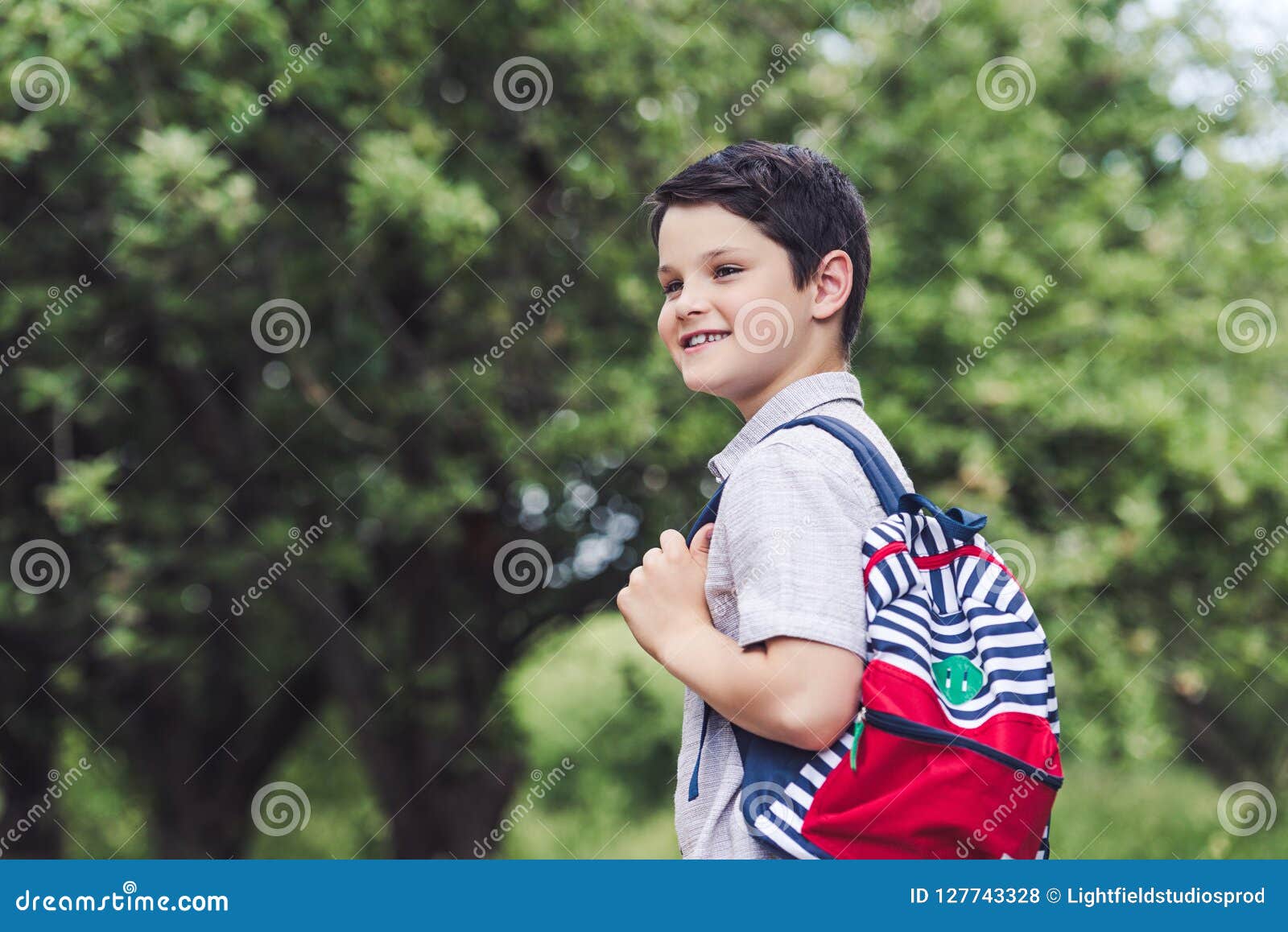 Happy Schoolboy with Backpack Looking Away Stock Photo - Image of male ...