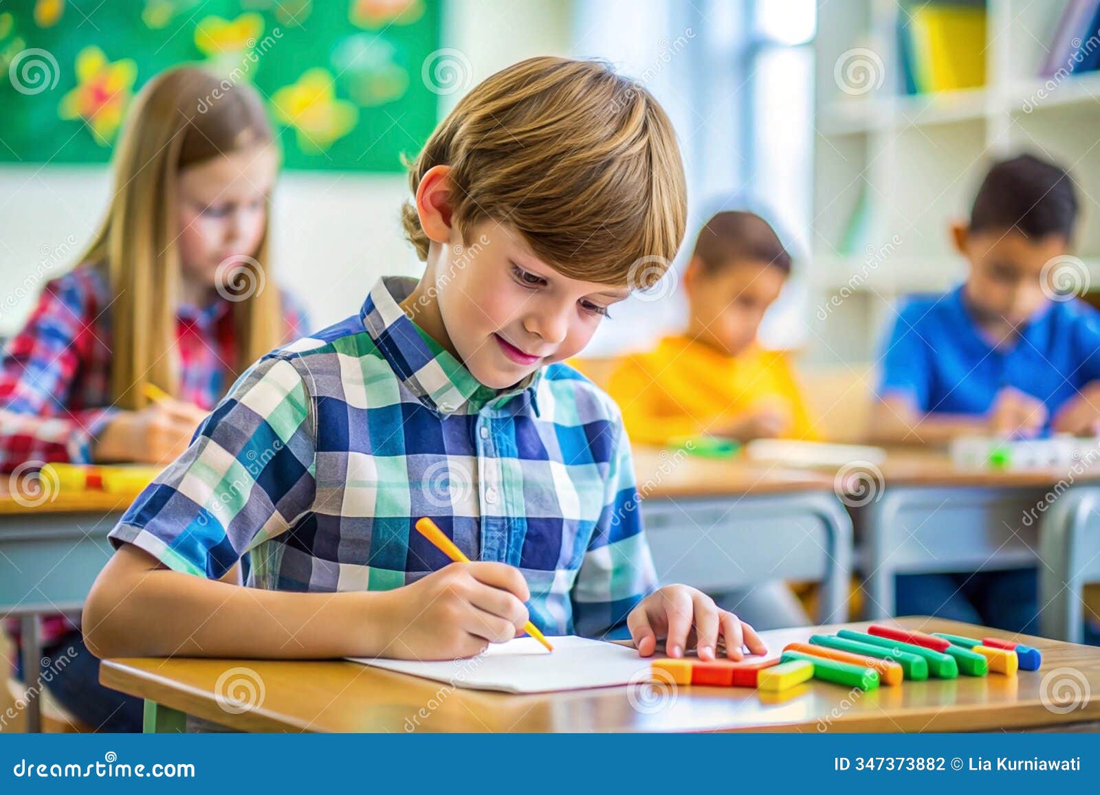 Happy Schoolboy Drawing in Elementary School Classroom with Classmates ...