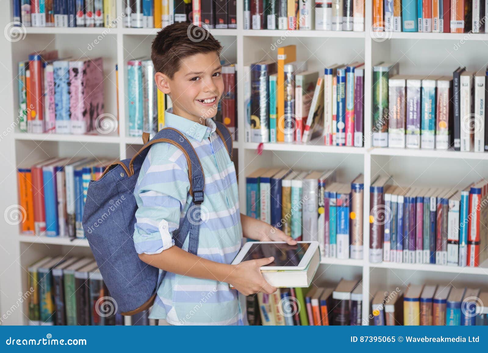 Happy Schoolboy Selecting Books in Library Stock Image - Image of ...