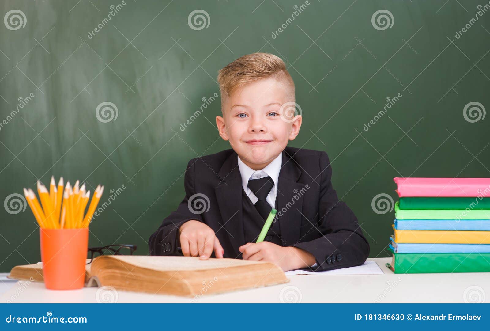 Happy Schoolboy in a Suit in Classroom Stock Photo - Image of glasses ...